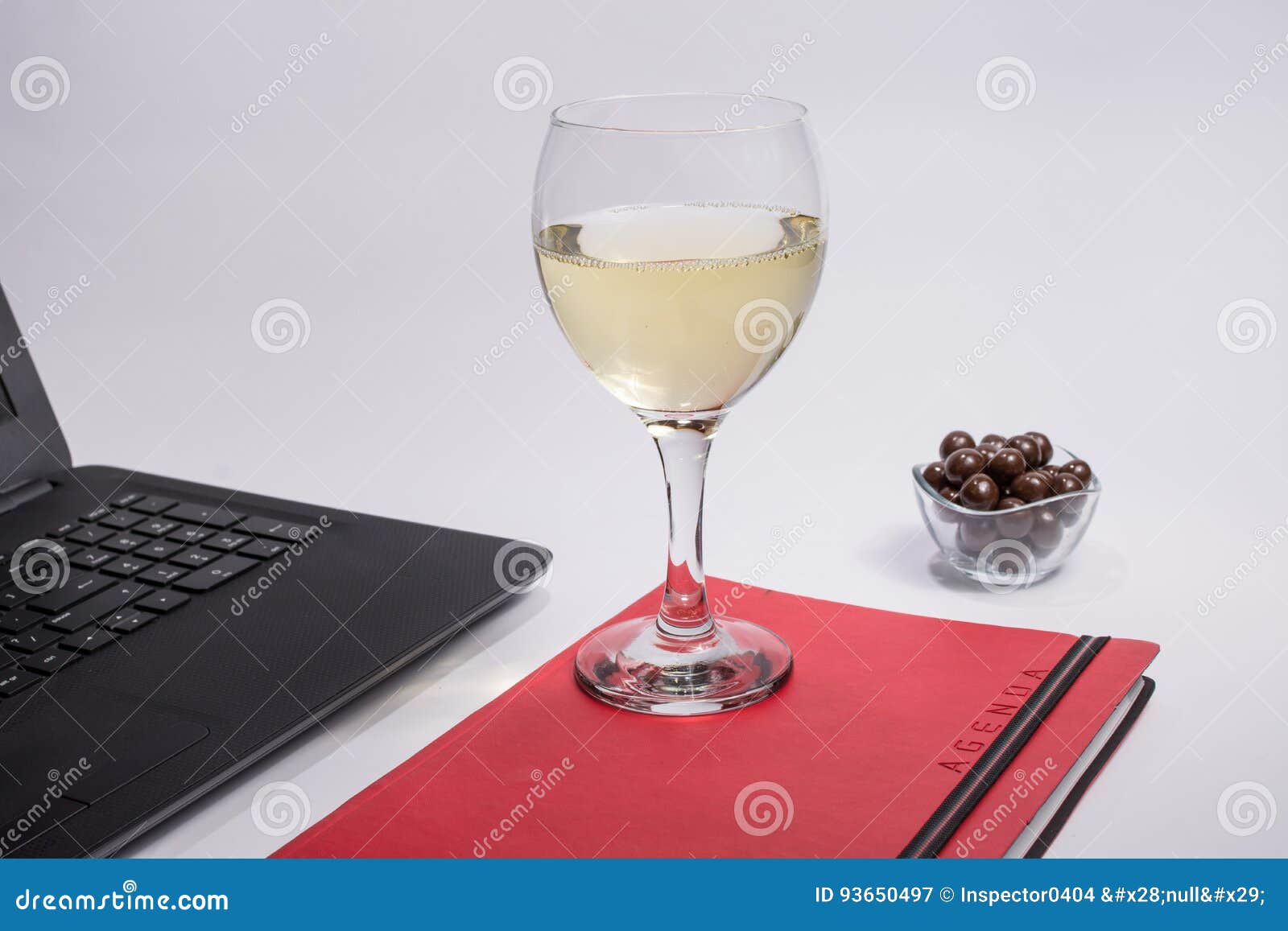 Workplace with Black Laptop Computer, Notebook, Chocolate Balls and ...