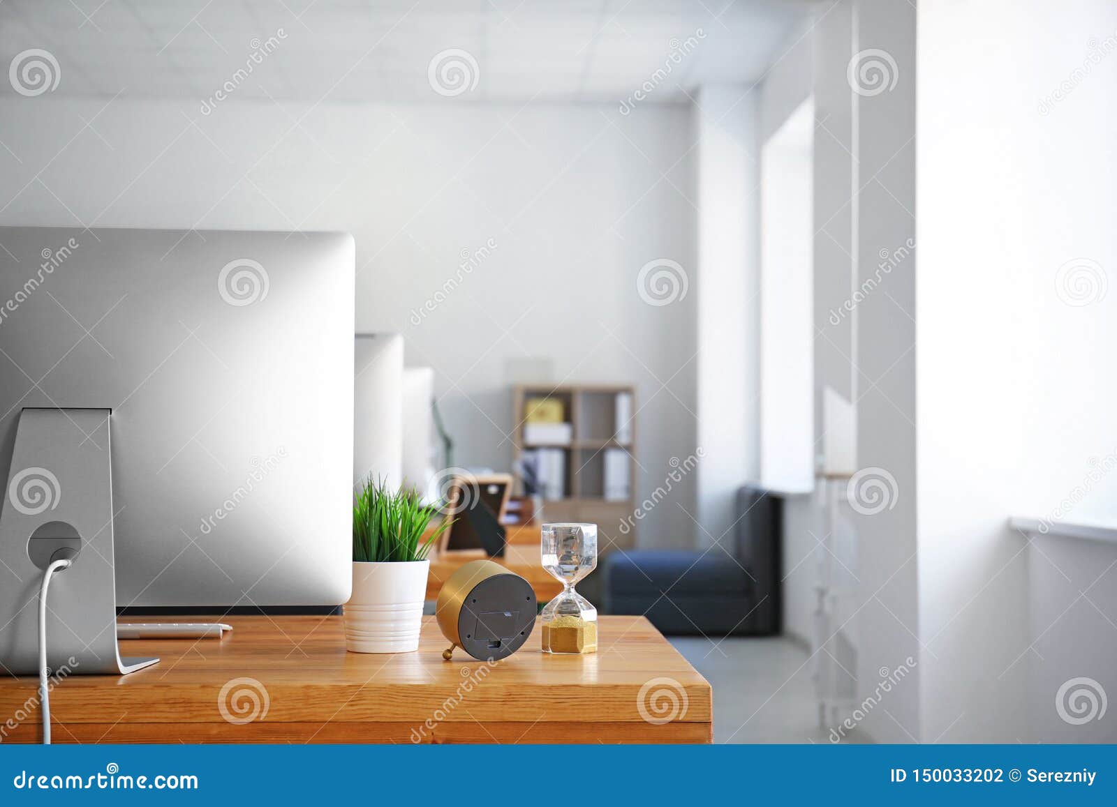 Workplace with Computer and Hourglass on Table in Modern Office Stock ...