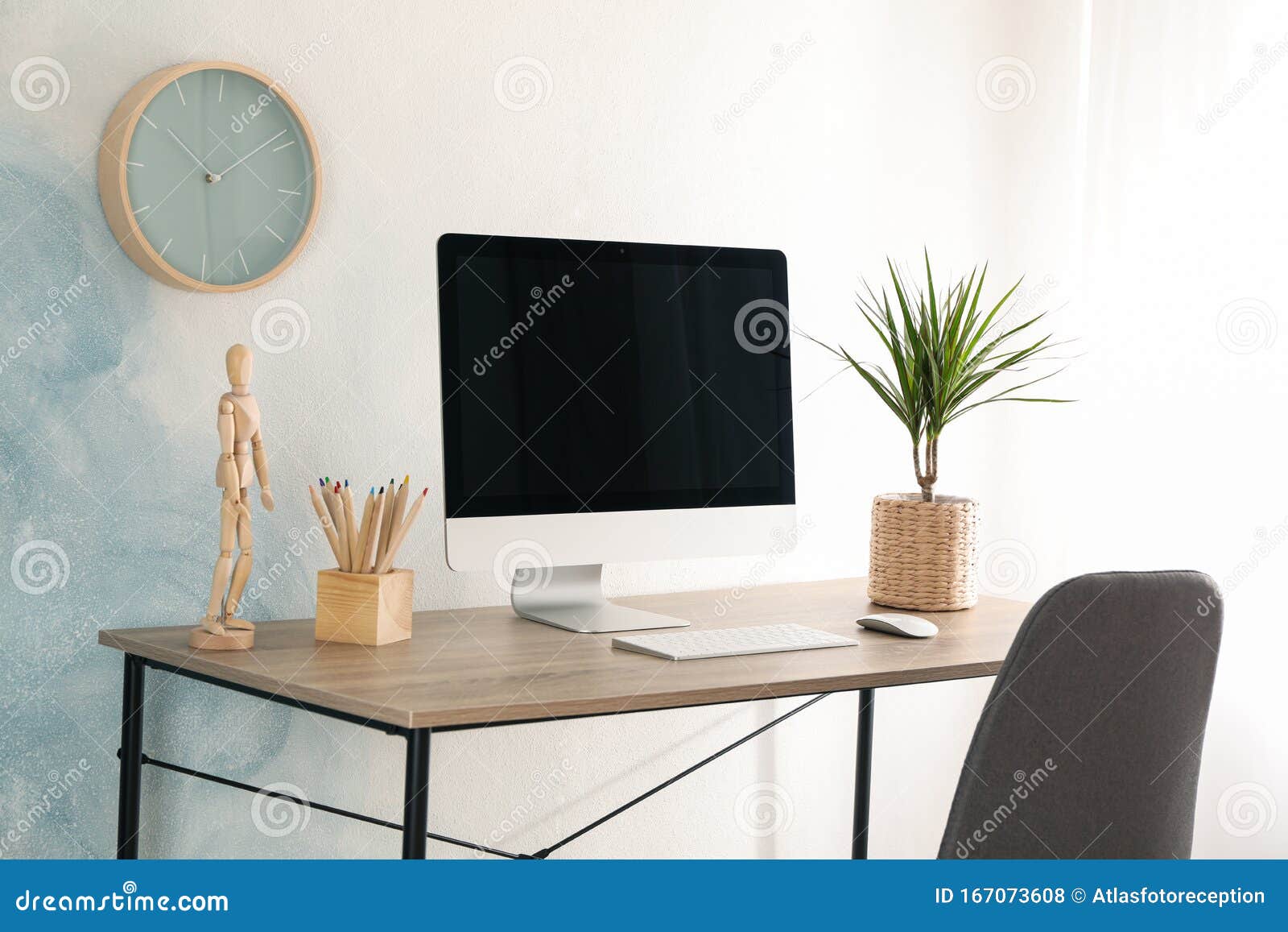 Workplace with Computer and Plant on Table. Light Blue and White ...