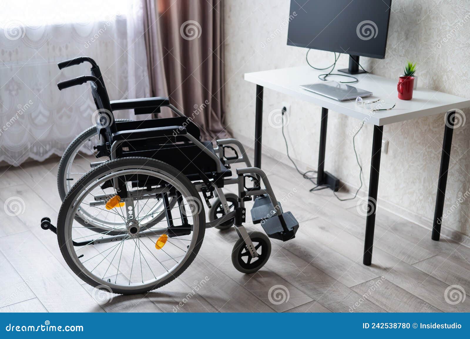 Workplace for a Disabled Person. Wheelchair at the Table with a ...