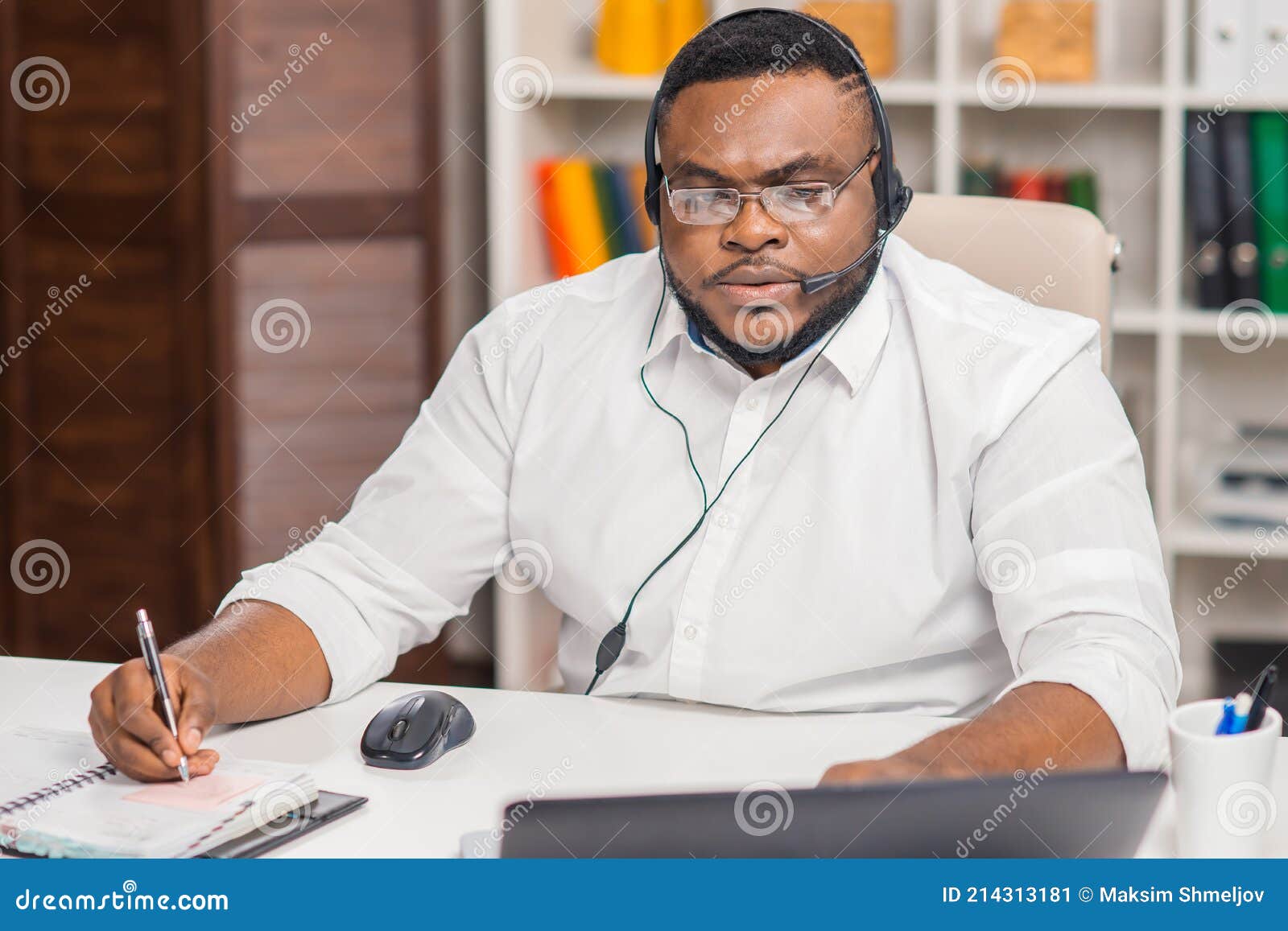 Workplace of Freelancer. African-American Man Works at Home Office ...