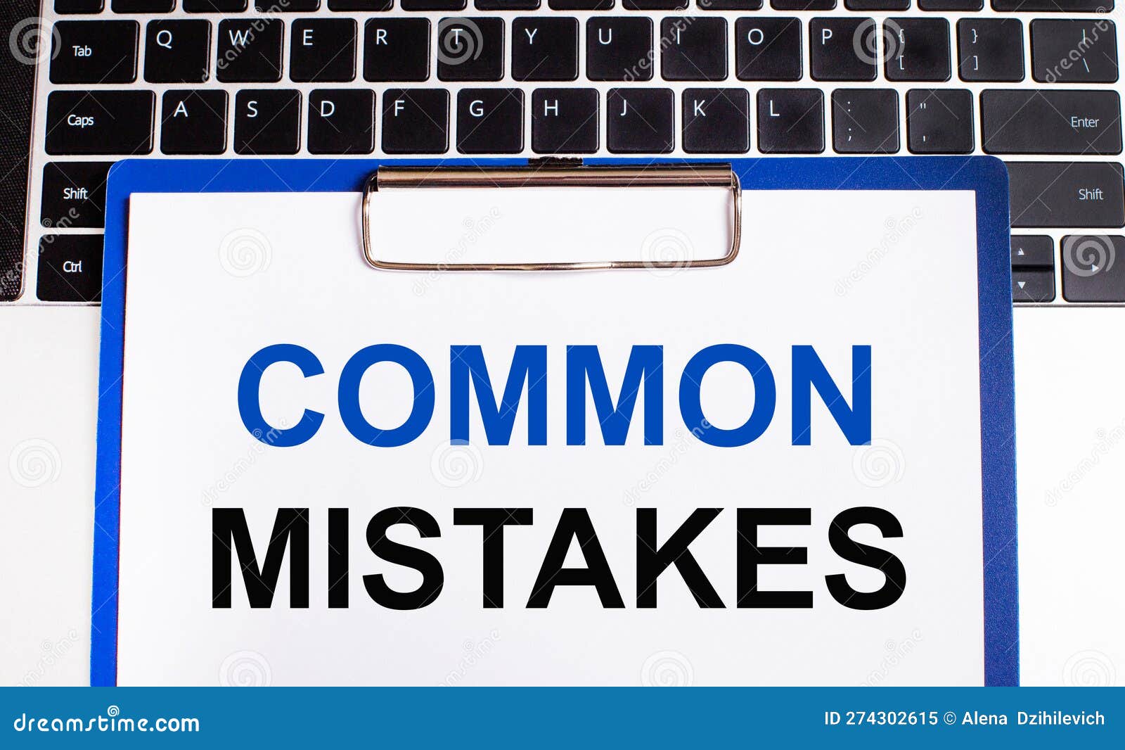 A Workplace with a Keyboard and a Tablet for Papers Wit Text COMMON ...