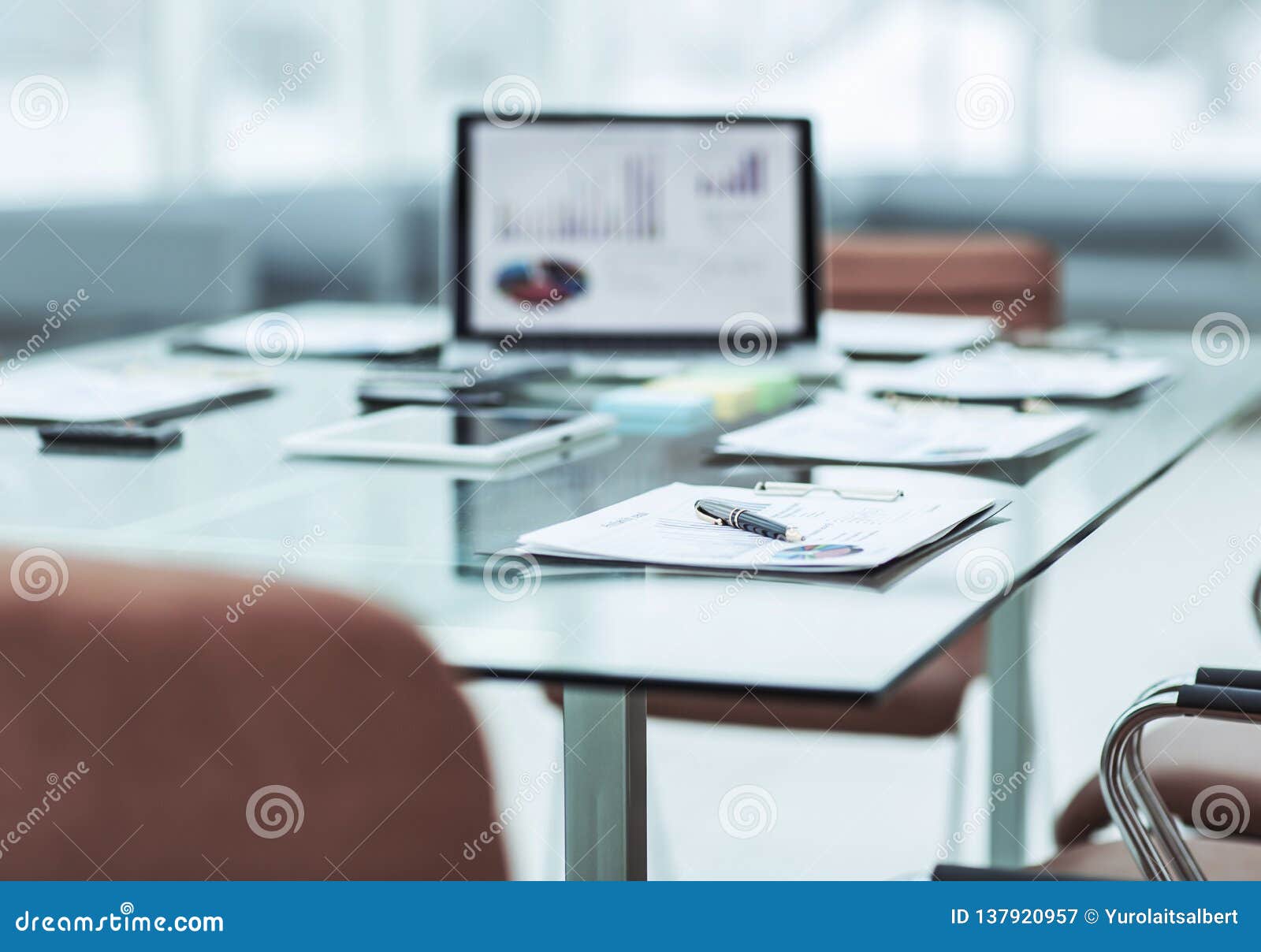 Workplace with Laptop and Working Documents for the Business Team in a ...