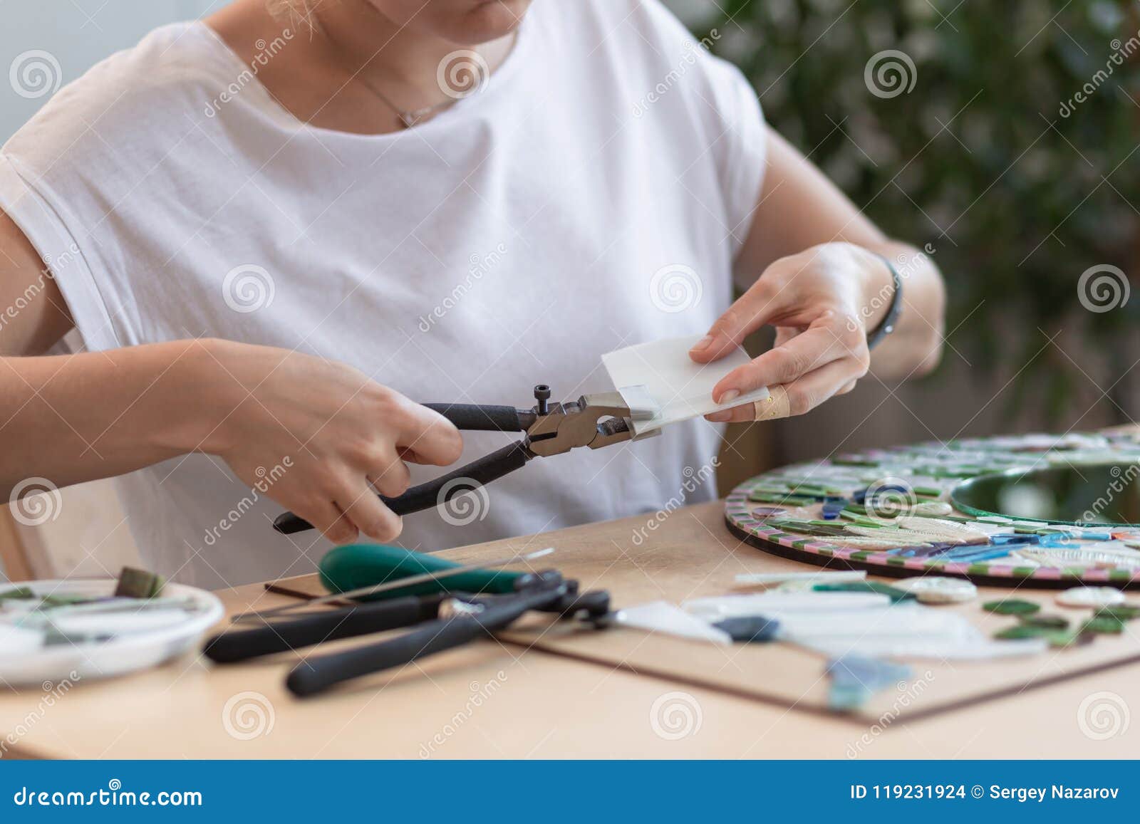 Workplace of the Mosaic Master: Women`s Hands Holding Tool for Mosaic ...