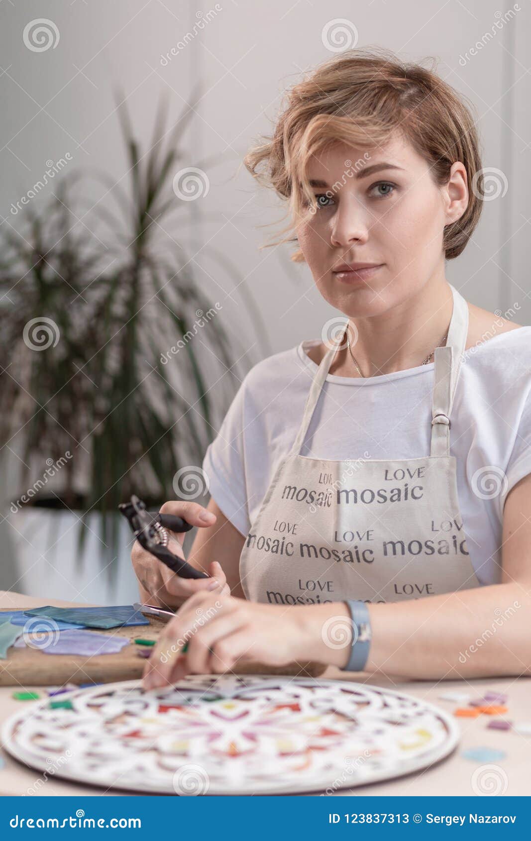 Workplace of the Mosaic Master: Women`s Hands Holding Tool for Mosaic ...
