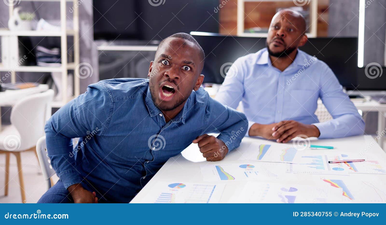 Workplace Quarrel. Angry Looking Man Looking Stock Image - Image of ...