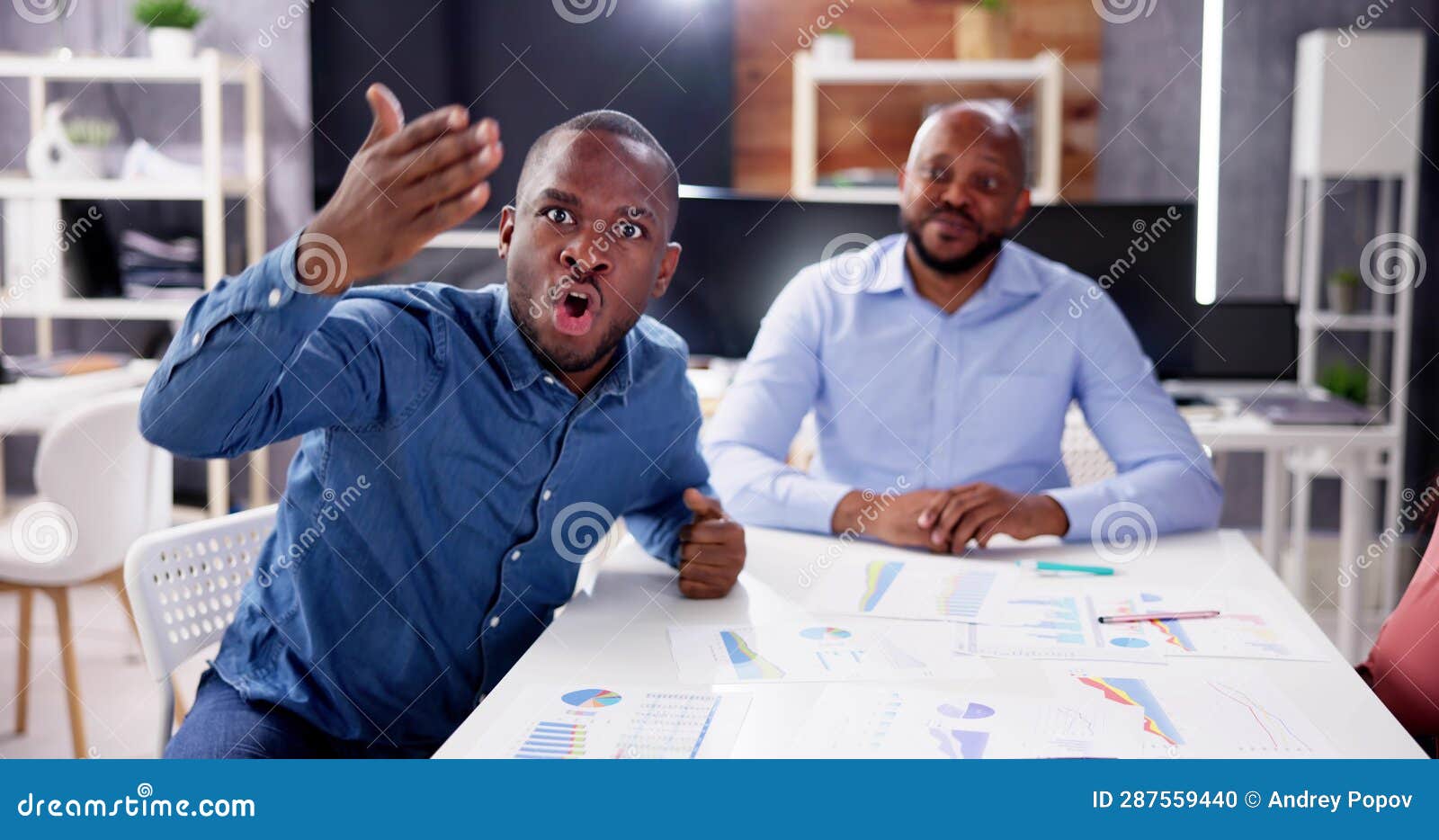 Workplace Quarrel. Angry Looking Man Looking Stock Photo - Image of ...