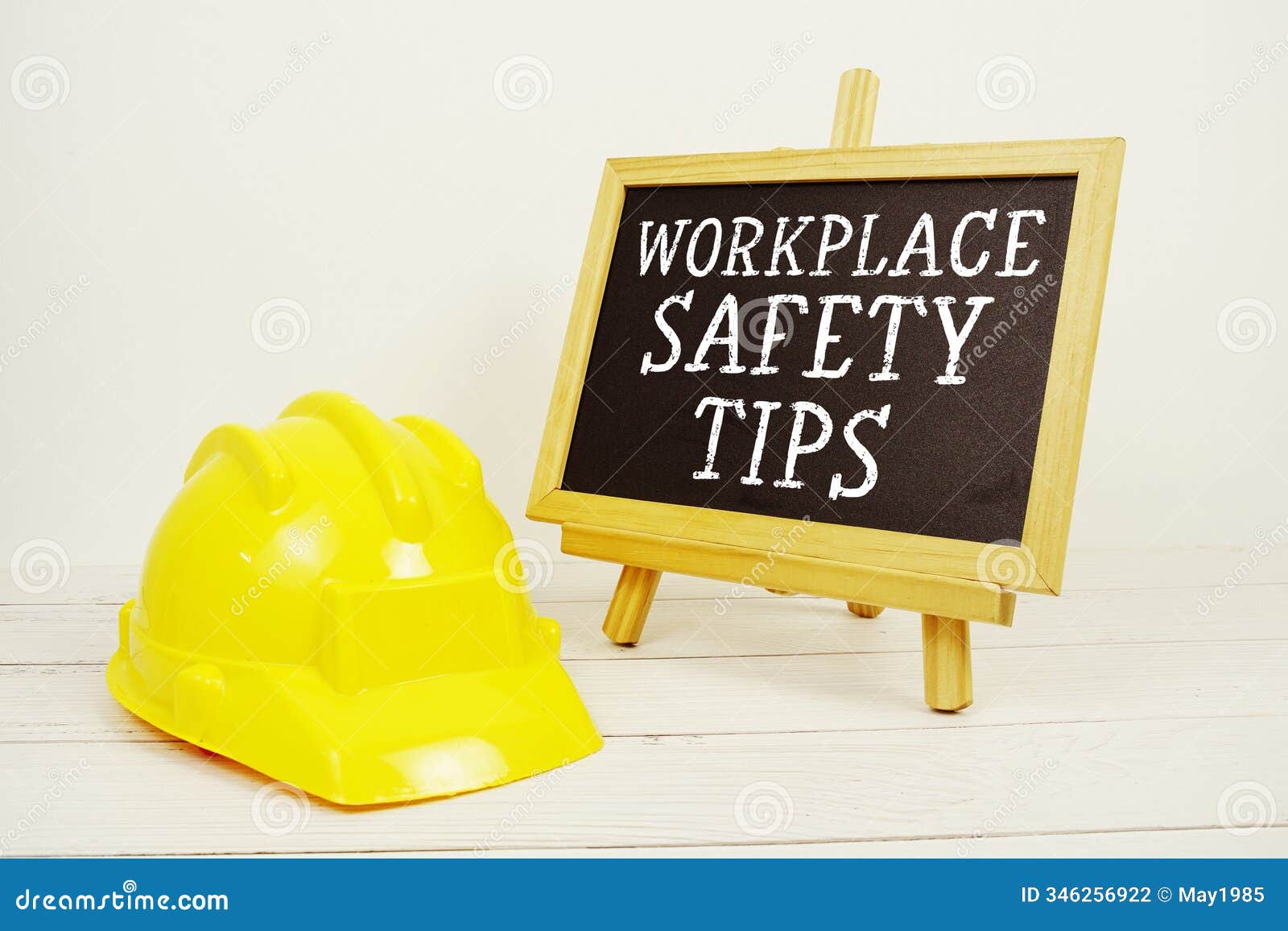 Workplace Safety Tips Text on Blackboard with Safety Helmet on Wooden ...