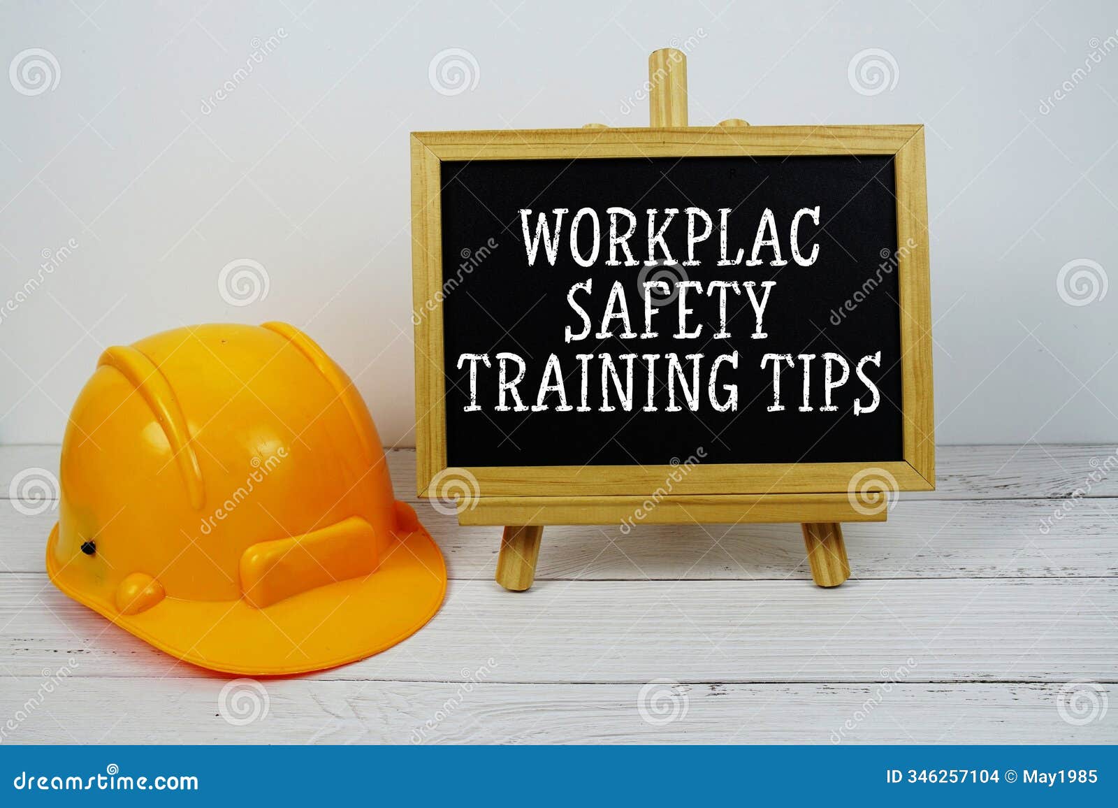 Workplace Safety Training Tips Text on Blackboard with Safety Helmet on ...