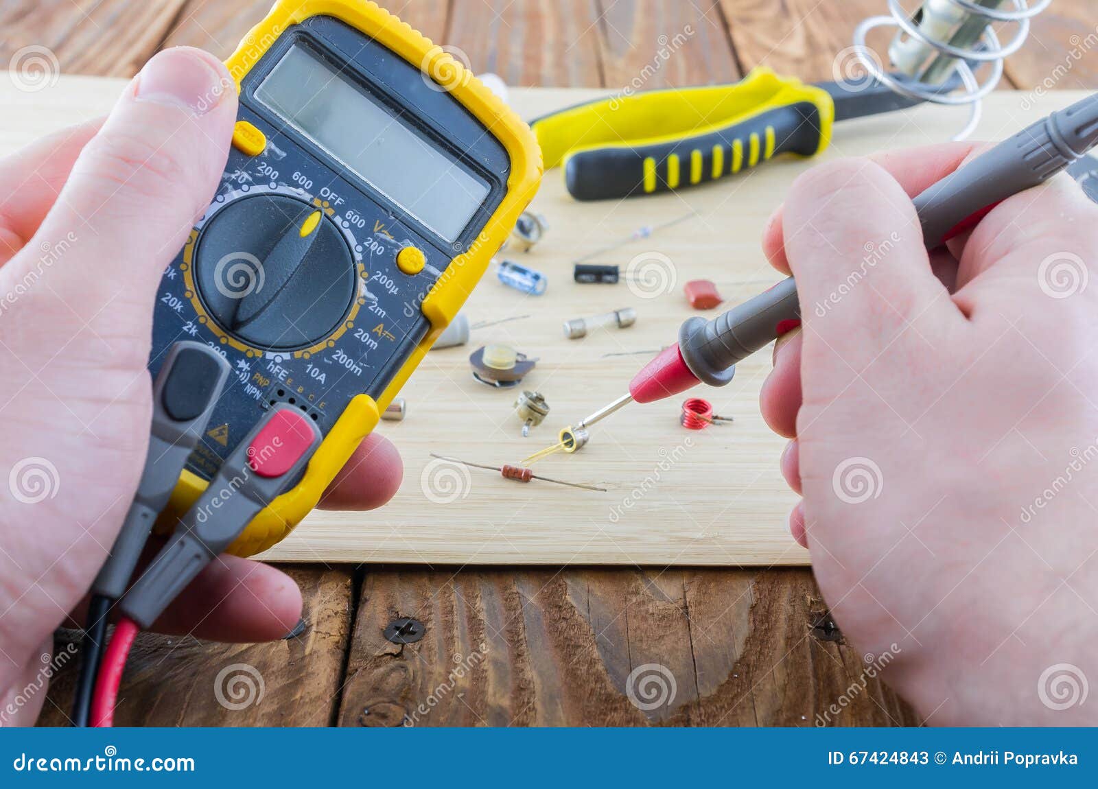 The Workplace of Serviceman. Hands Holding the Multimeter Stock Image ...