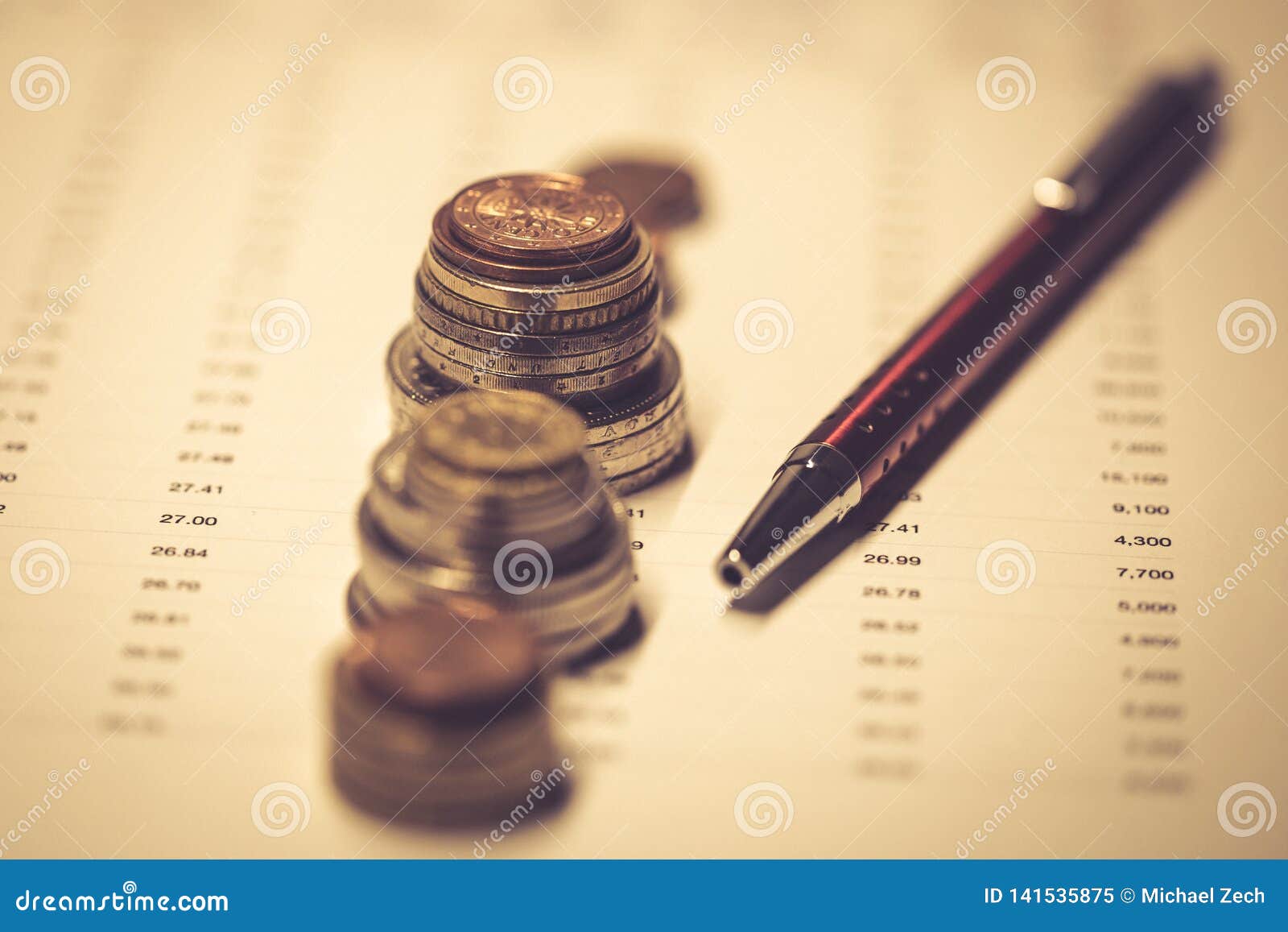 Workplace with Stacked Coins on Business Documents, Charts and Pen ...