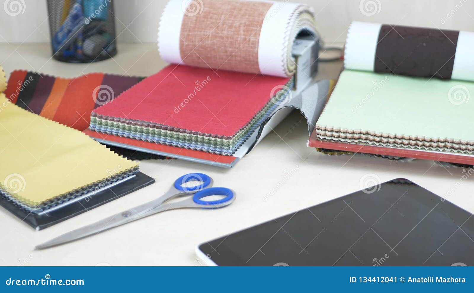 Workplace of Tailor with Fabric Samples of Different Colors on Table ...
