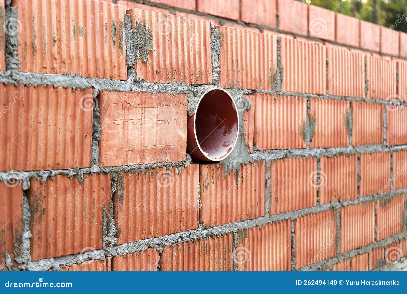 Works on the Laying of Ceramic Bricks. Red Brick Wall with Ventilation ...