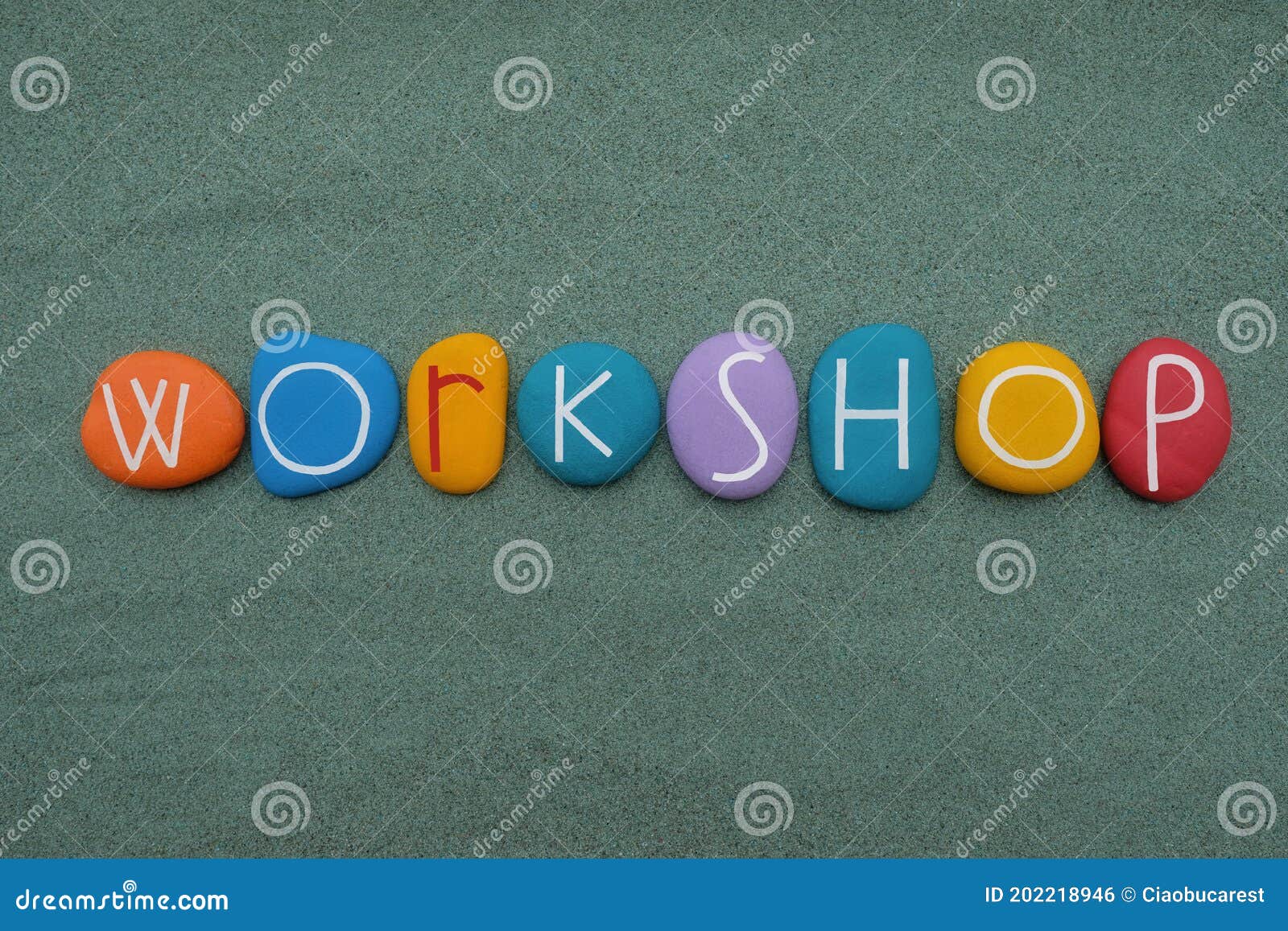Workshop Text Composed with Multicolored Stone Letters Over Green Sand ...