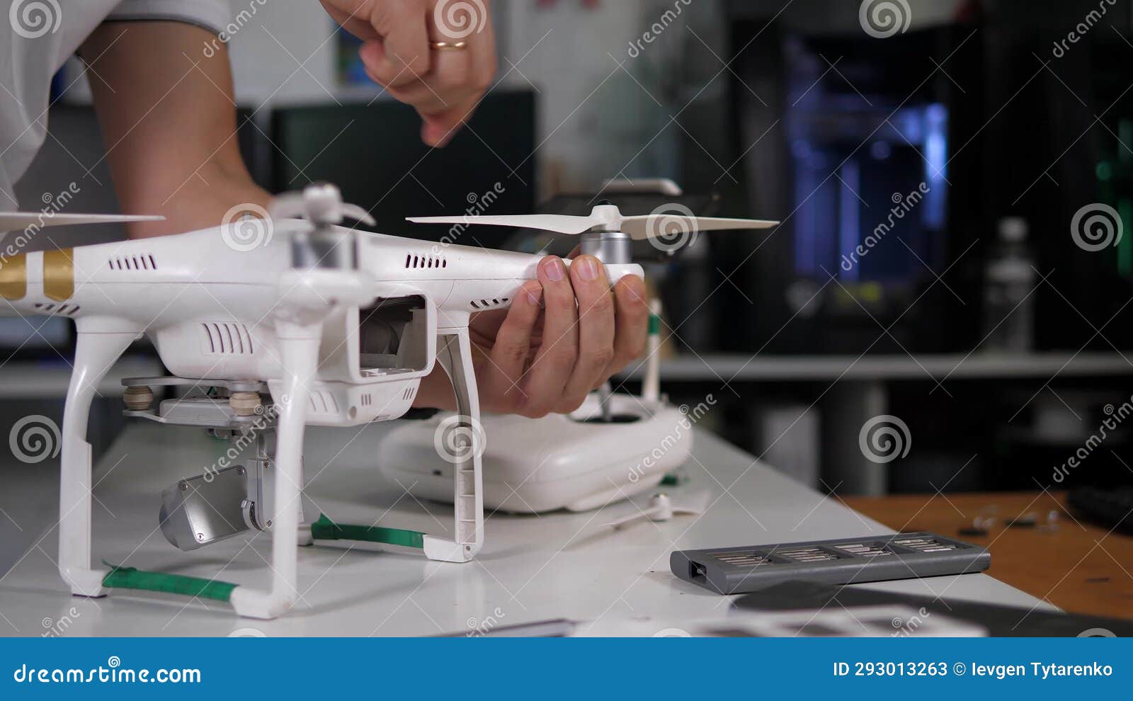 Close-up of an Engineer Repairing a Quadcopter in the Studio. Stock ...