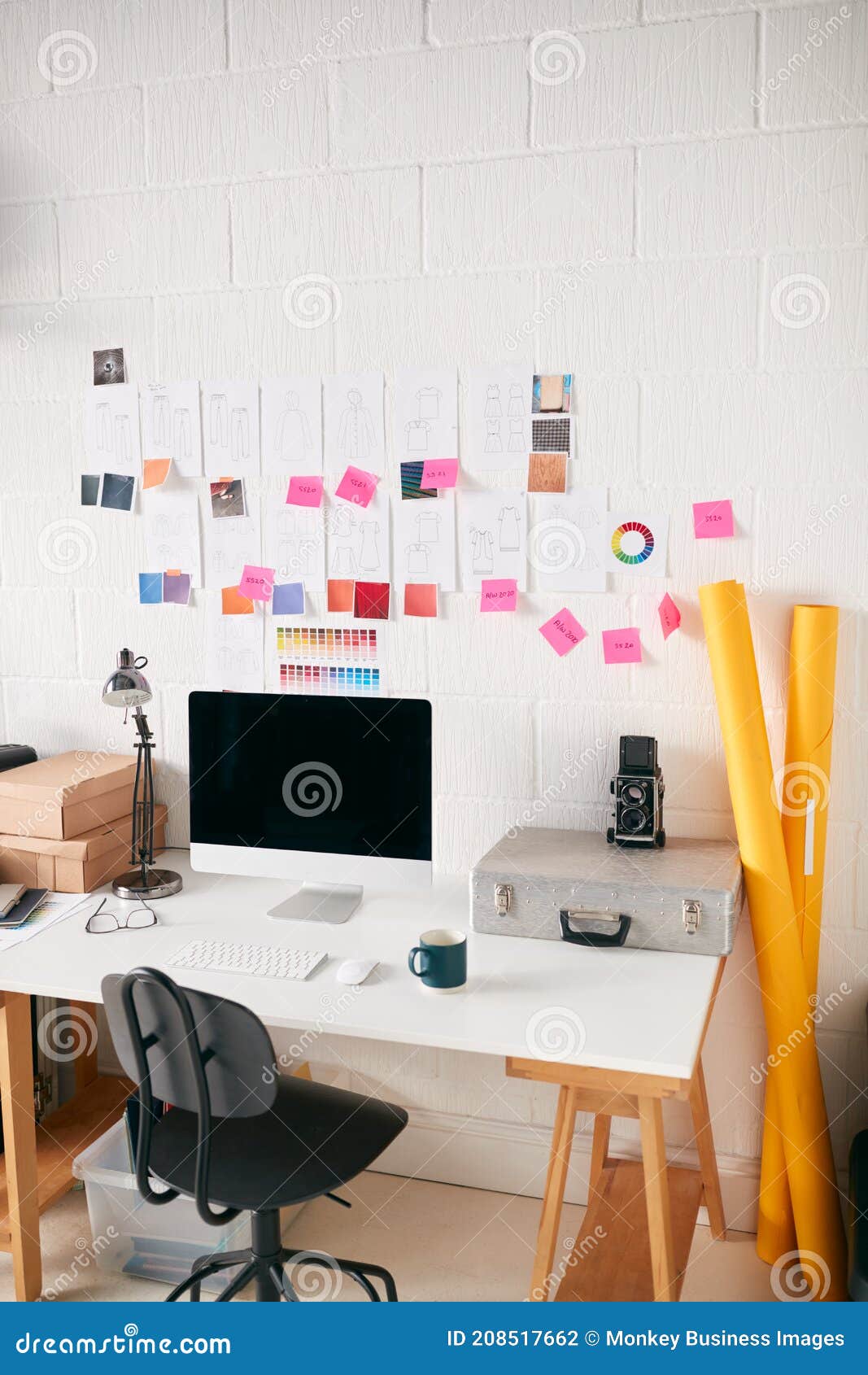 Workspace in Creative Studio with Desk and Computer in Front of Wall ...
