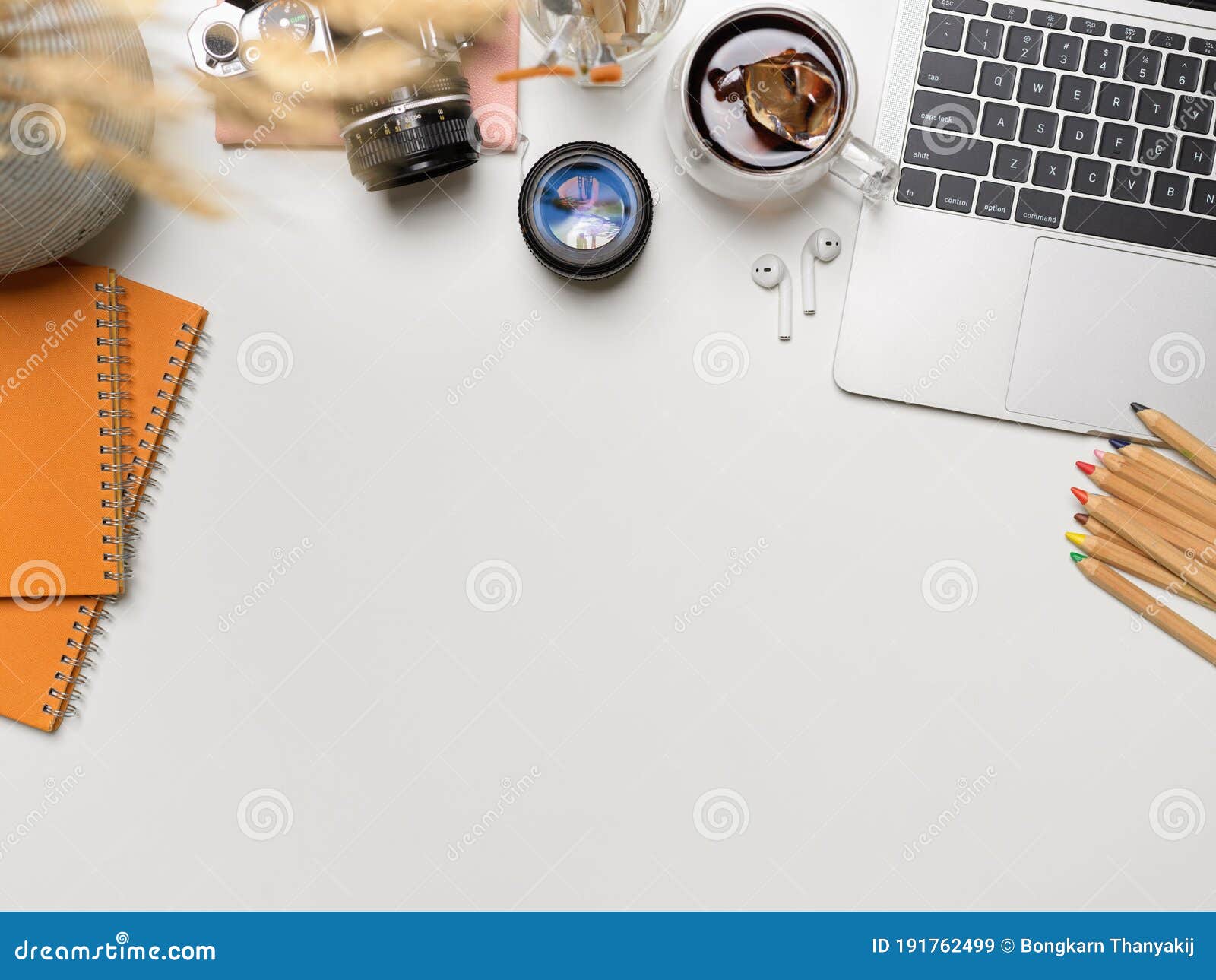 Workspace with Laptop, Camera, Stationery, Paint Tools, Accessories and ...