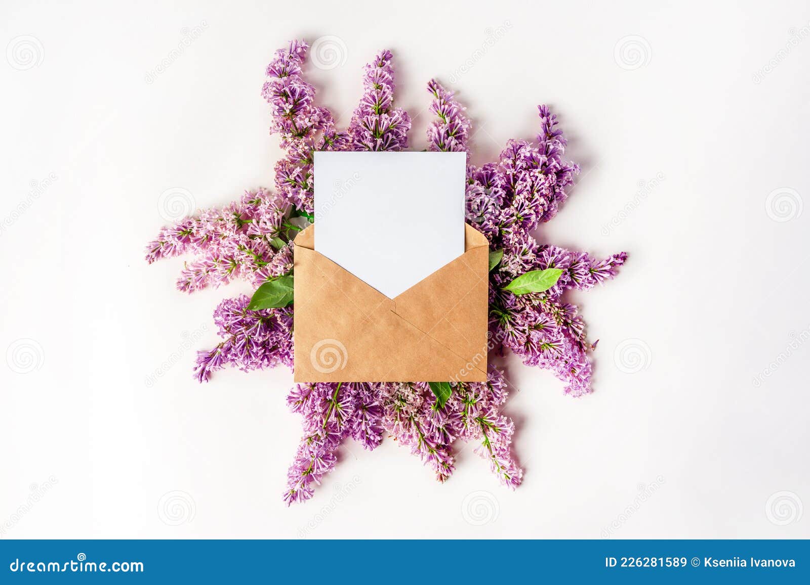 A Workspace with Note Paper and a Lilac Floral Composition. Beautiful ...