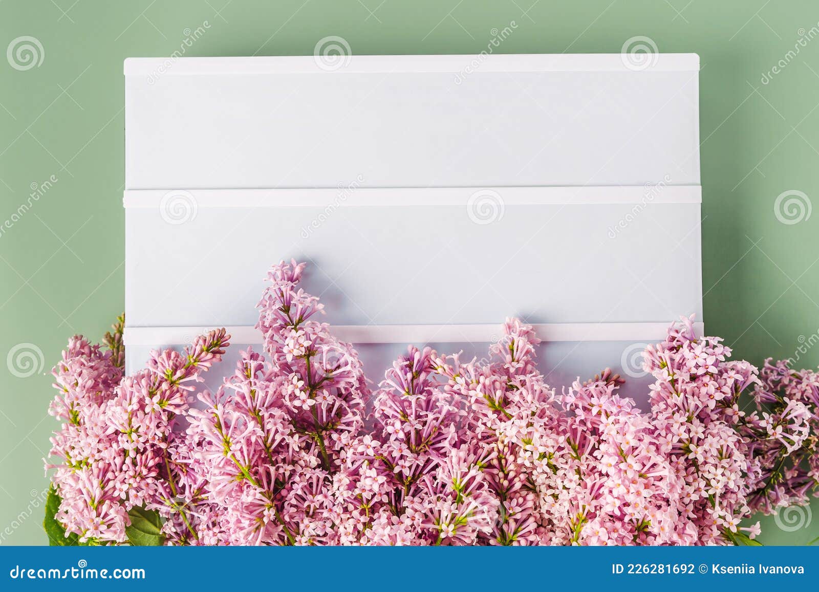 A Workspace with Note Paper and a Lilac Floral Composition. Beautiful ...