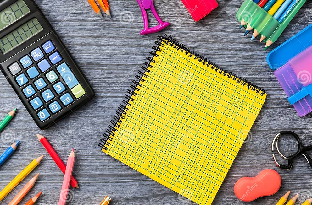 A Workspace with Stationery, a Calculator, and a Notepad for Studying ...