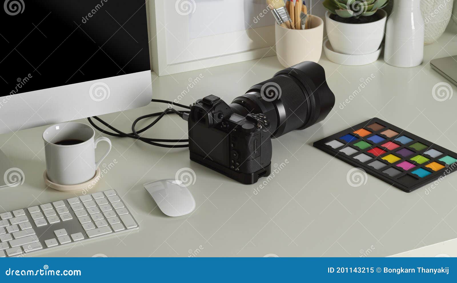 Worktable with Camera, Colour Checker, Computer Device and Decorations ...