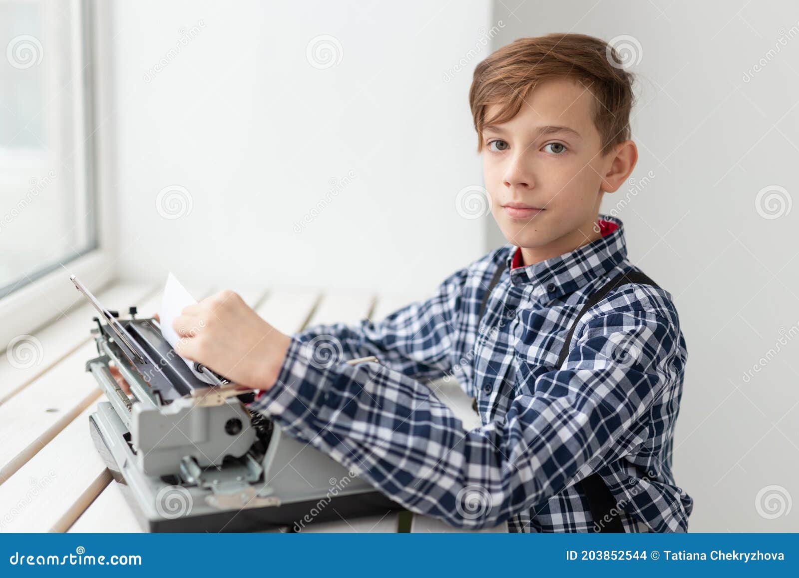 World Day of the Writer Concept - Boy with an Old Typewriter Stock ...