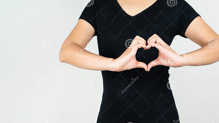 World Heart Day Concept Of Woman Making A Heart Gesture With Her