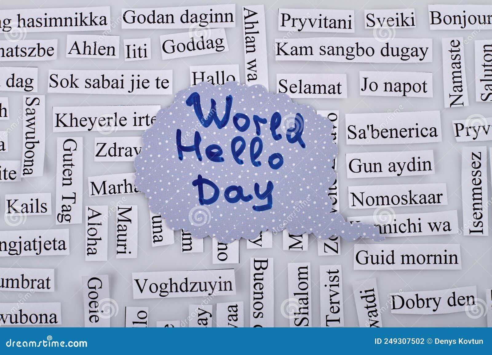 World Hellow Day Concept. Paper Pieces on White Background Stock Photo ...