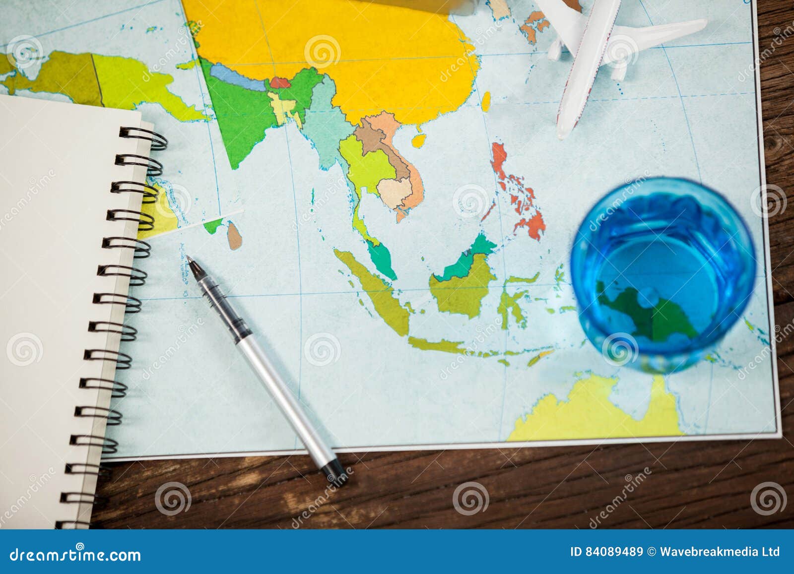 World Map, Notepad, Pen Airplane and Glass Stock Image - Image of ...