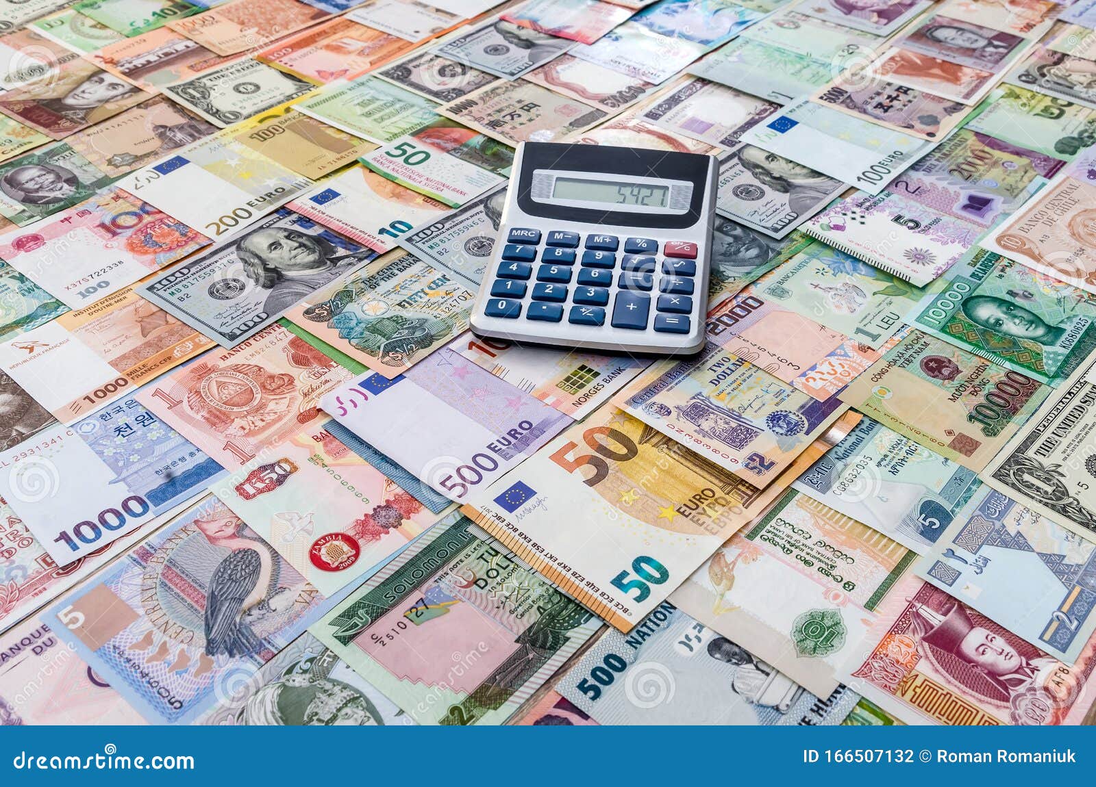 World Money Collection with Calculator on it Stock Photo - Image of ...
