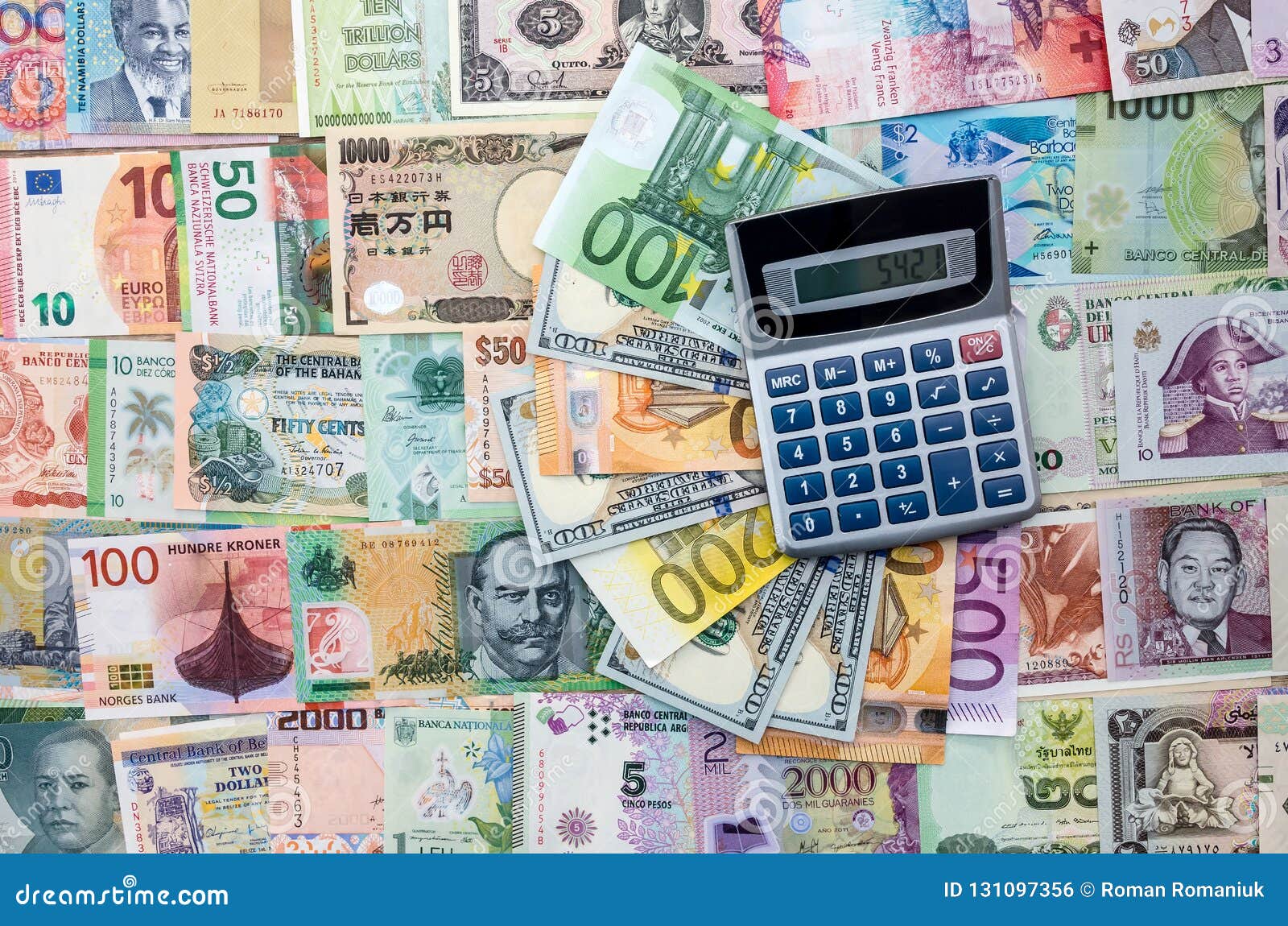 World Money Collection with Calculator on it Stock Photo - Image of ...