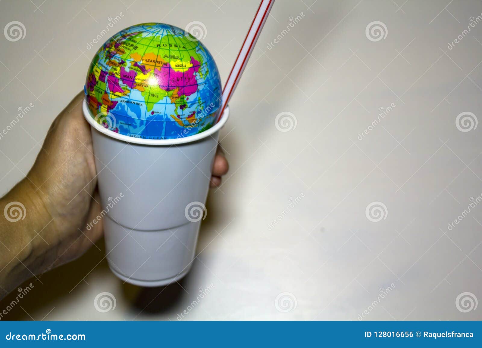 World on a Plastic Cup and a Plastic Straw. Plastic Pollution Concept ...