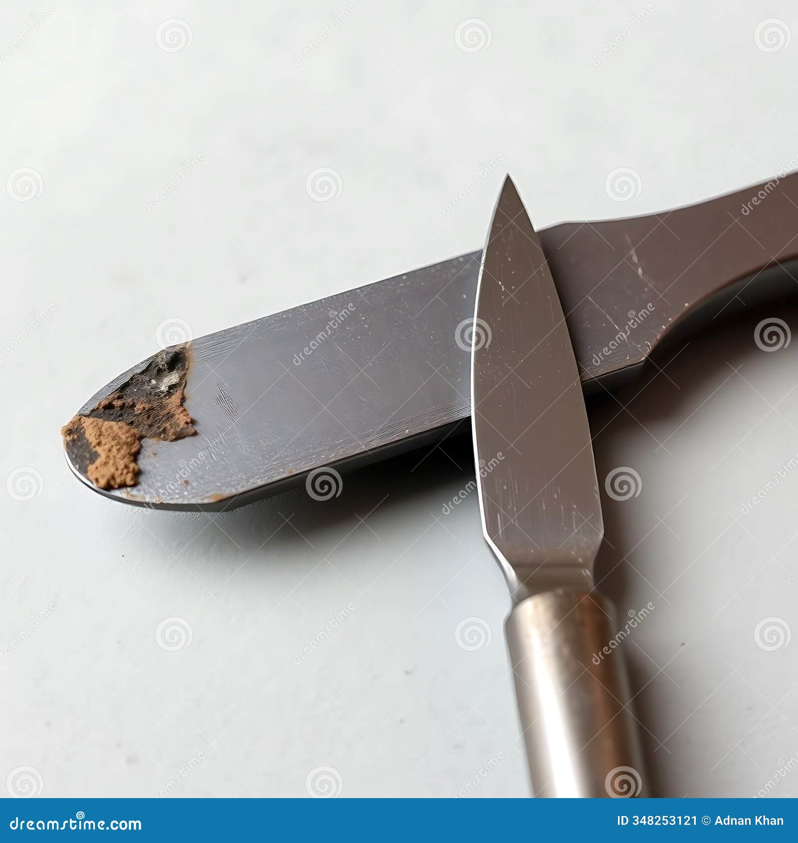 A Worn Deburring Tool with a Slightly Rusted Edge Laid Next To a ...