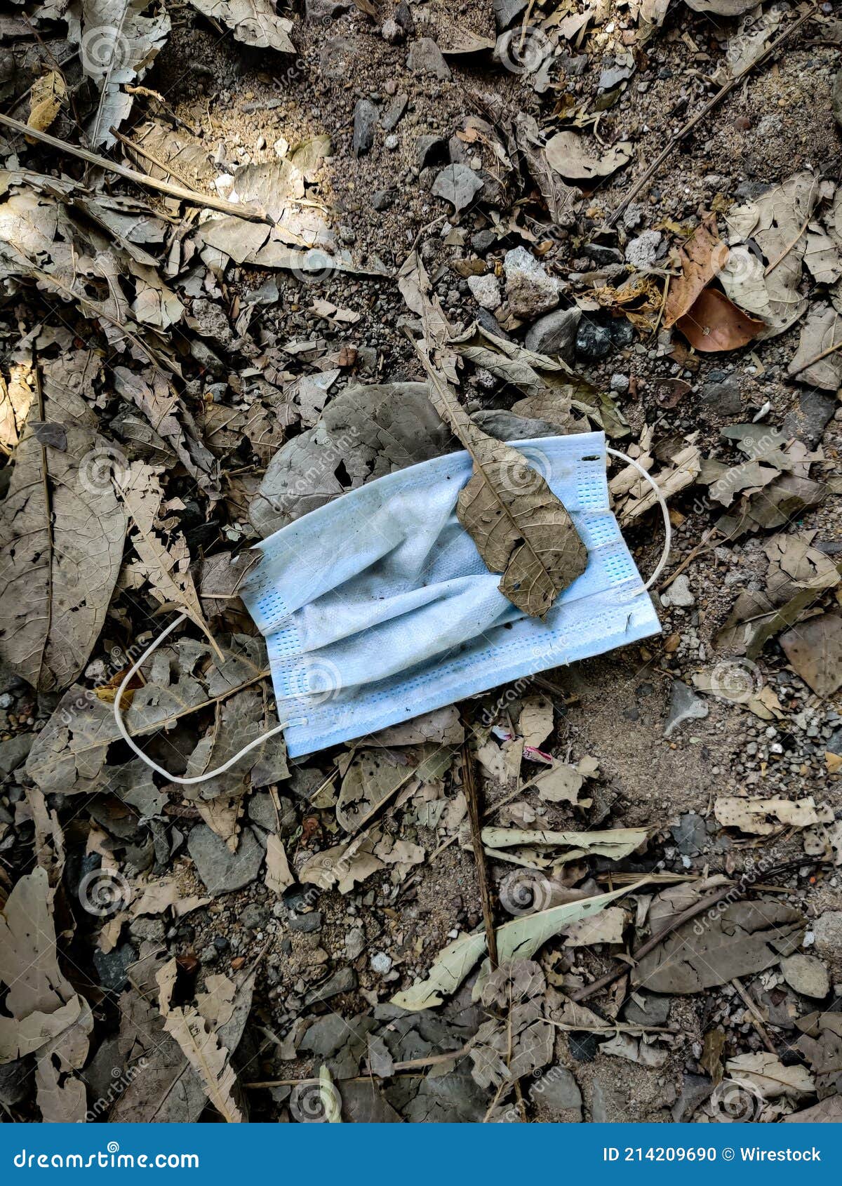 Worn Dirty Face Mask on the Ground Stock Photo - Image of garbage, mask ...