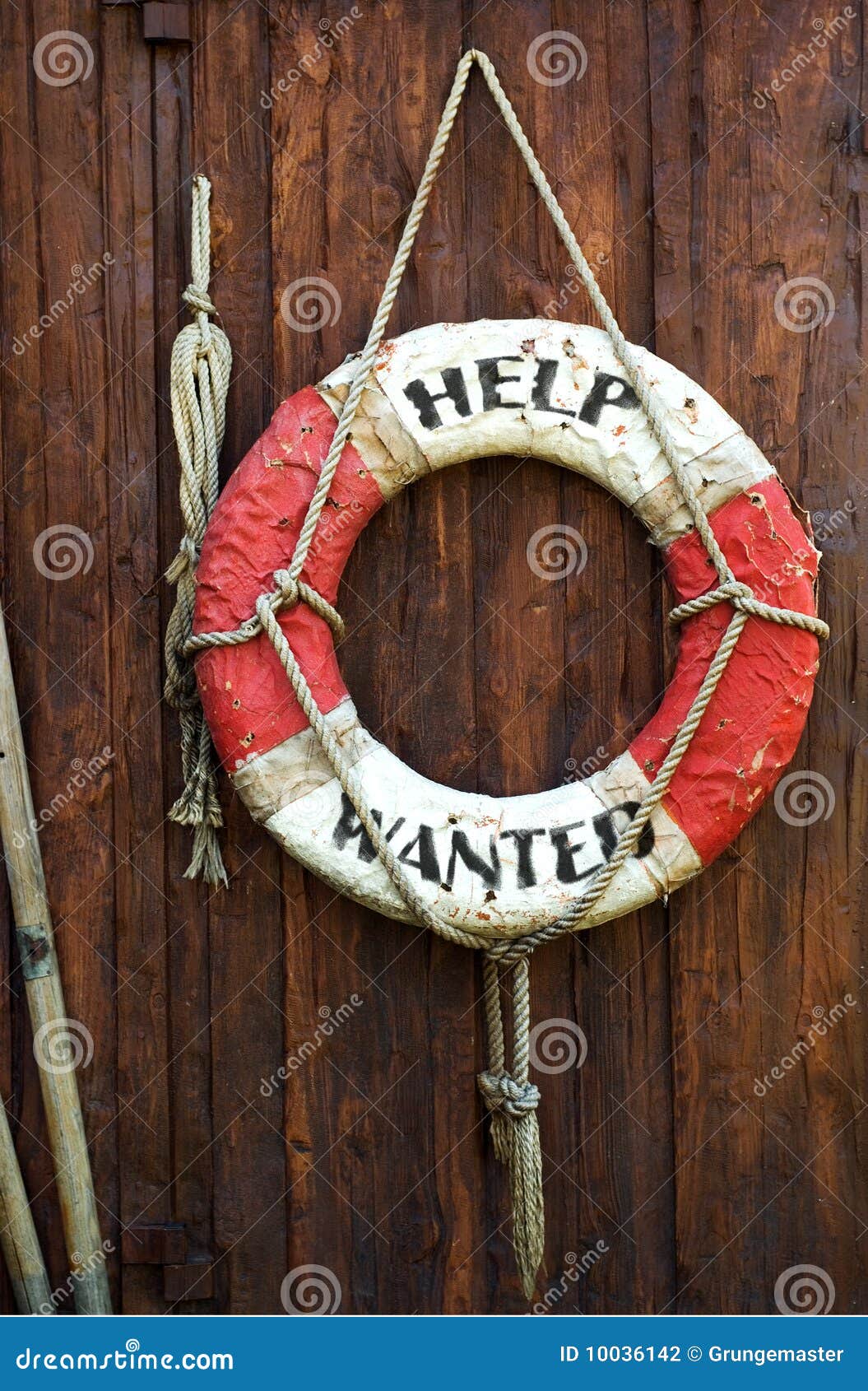 A Worn Life Saver with the Caption Help Wanted Stock Photo - Image of ...