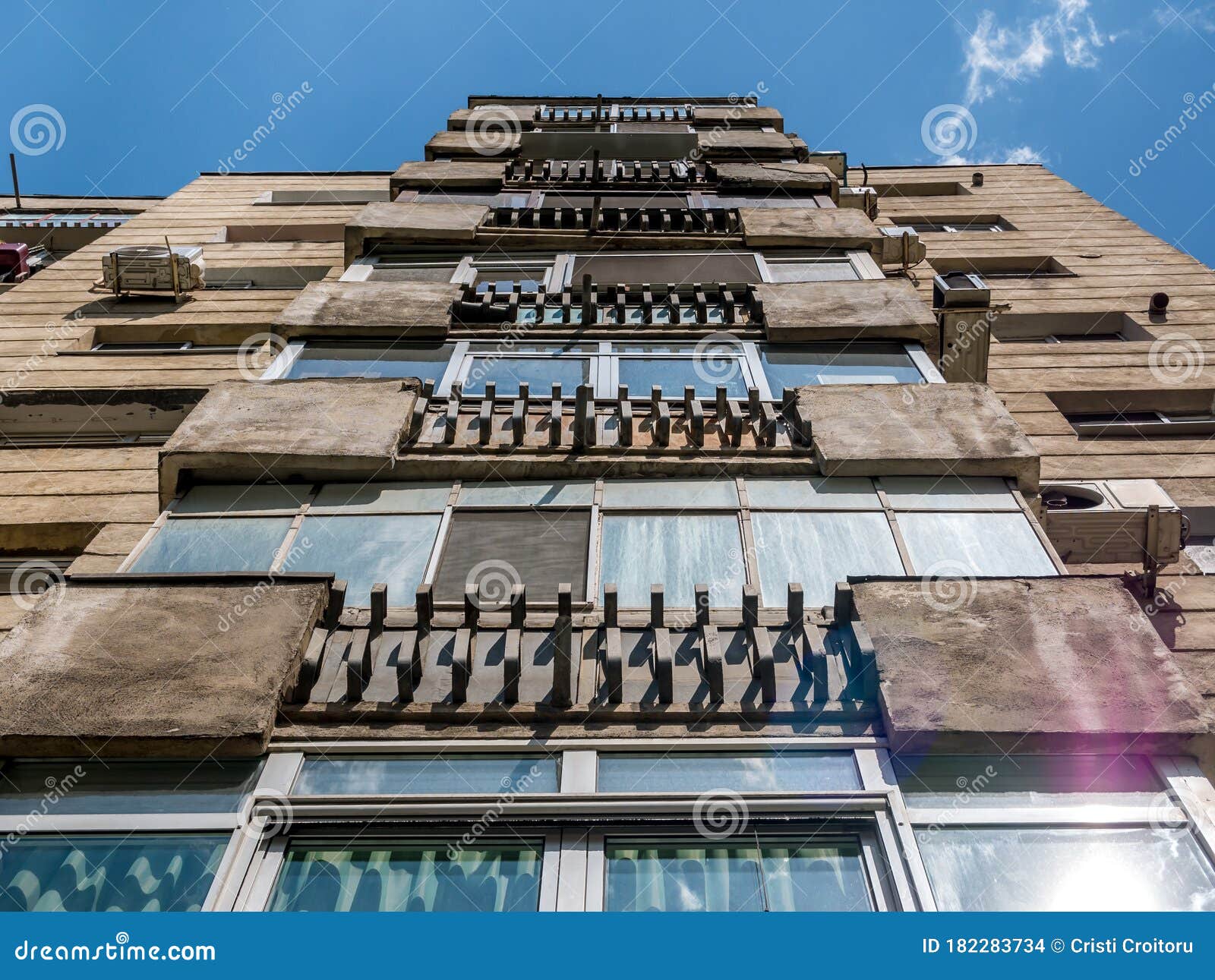Worn Out Apartment Building from the Communist Era Against Blue Sky in ... Worn Out Apartment Building from the Communist Era Against Blue Sky in ...