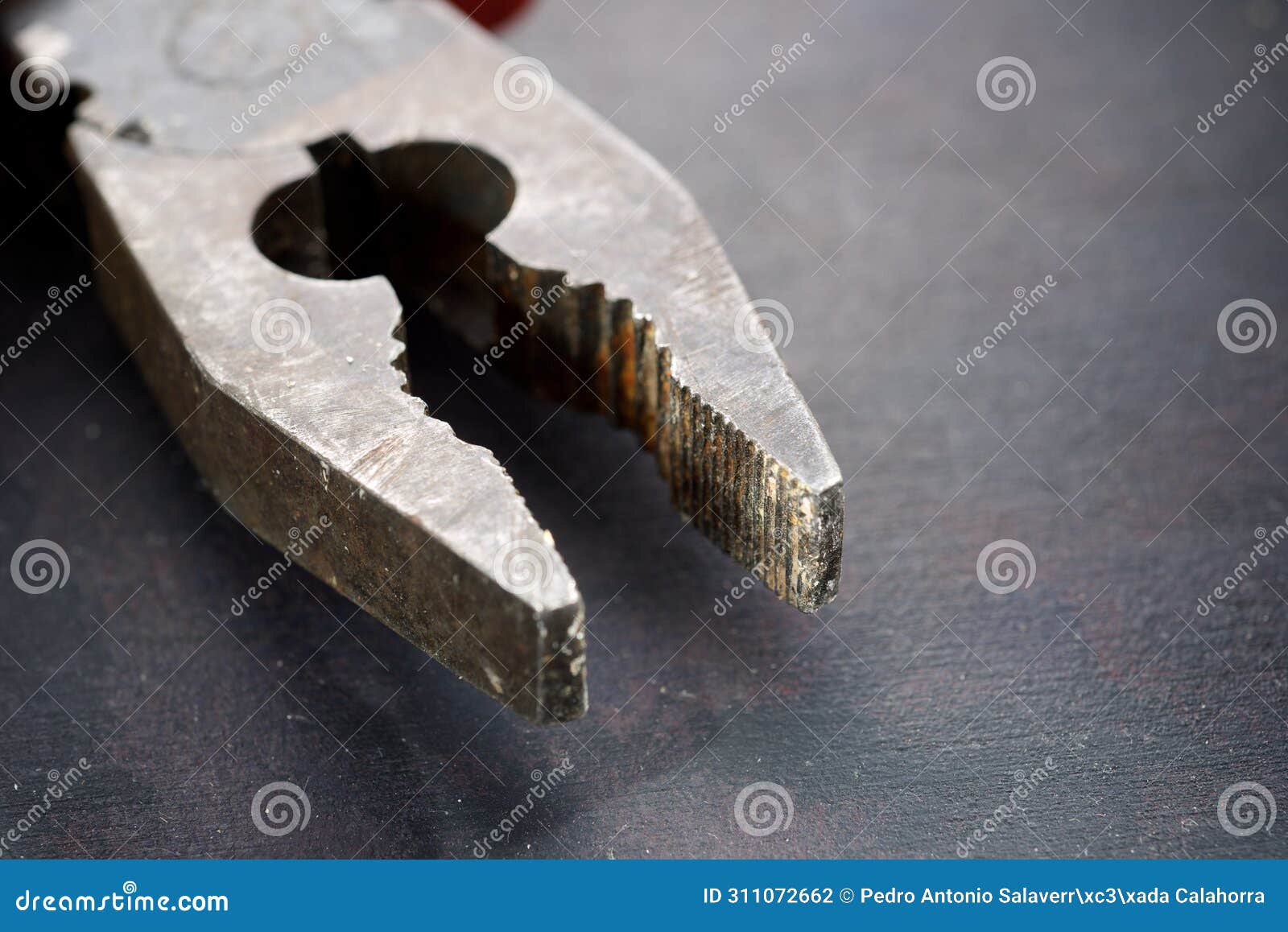 Worn Pliers on a Black Workbench Stock Photo - Image of aged, copy ...
