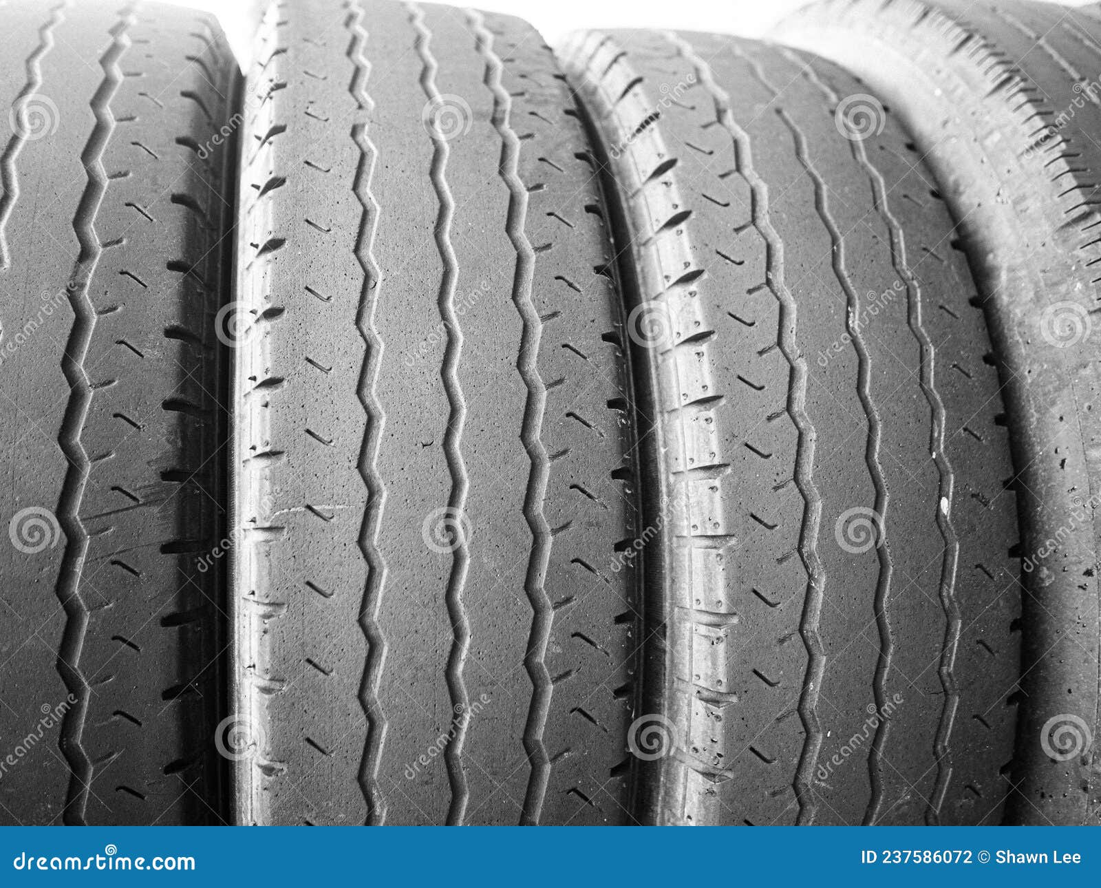 Worn Tyres Stacked Side by Side Sidelit Stock Photo - Image of rubber ...
