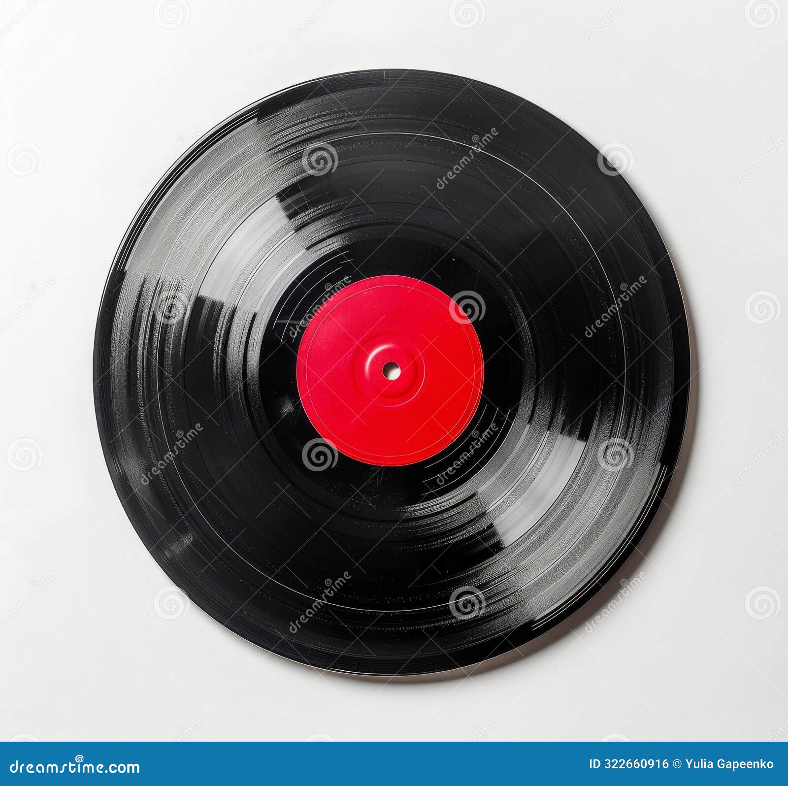 A Worn Vinyl Record with a Red Label on a White Background Stock Photo ...