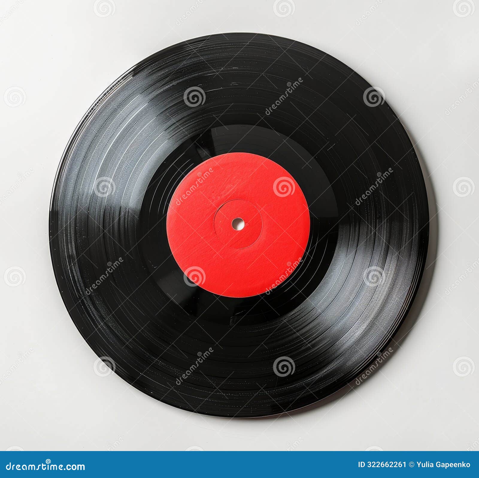 A Worn Vinyl Record with a Red Label on a White Background Stock Image ...