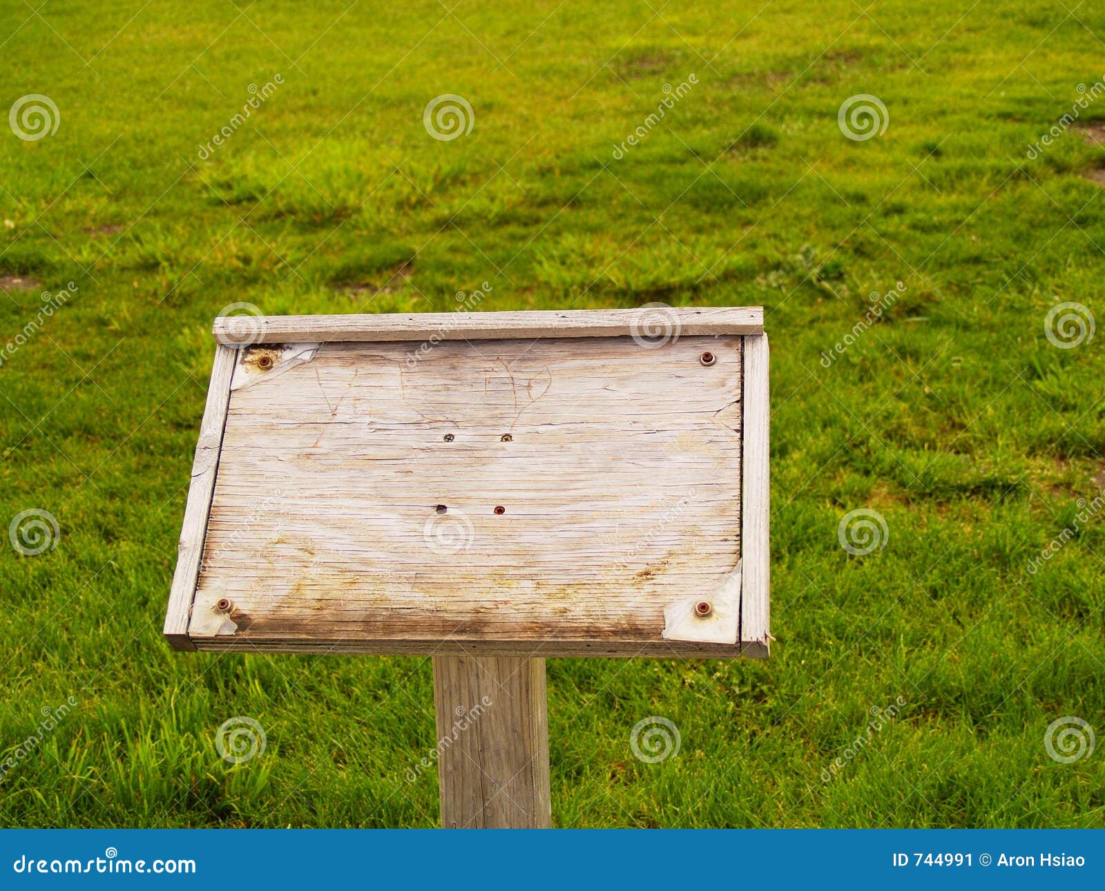 Worn Wooden Sign in Grassy Field Stock Image - Image of empty, stand ...