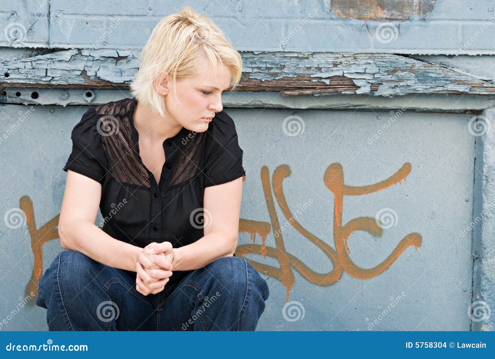 Blond Woman Worried while Ringing Hands Stock Photo - Image of ...