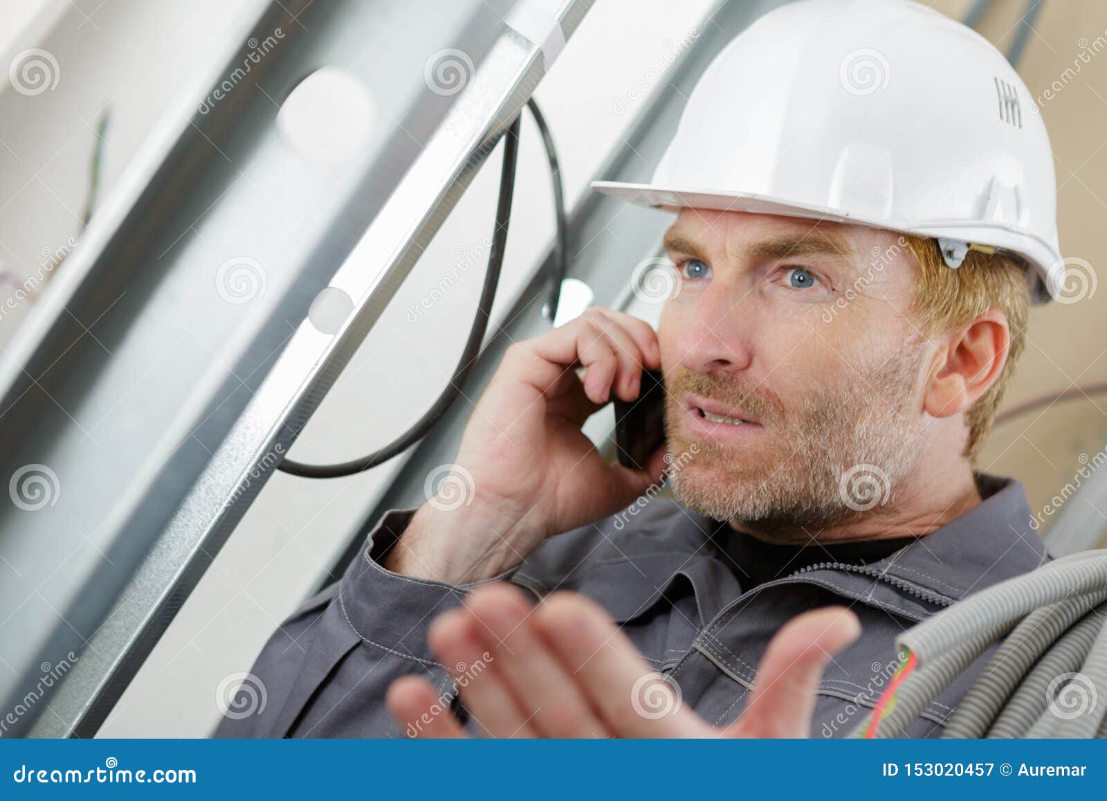 Worried Architect or Builder Talking on Mobile Phone Stock Image ...