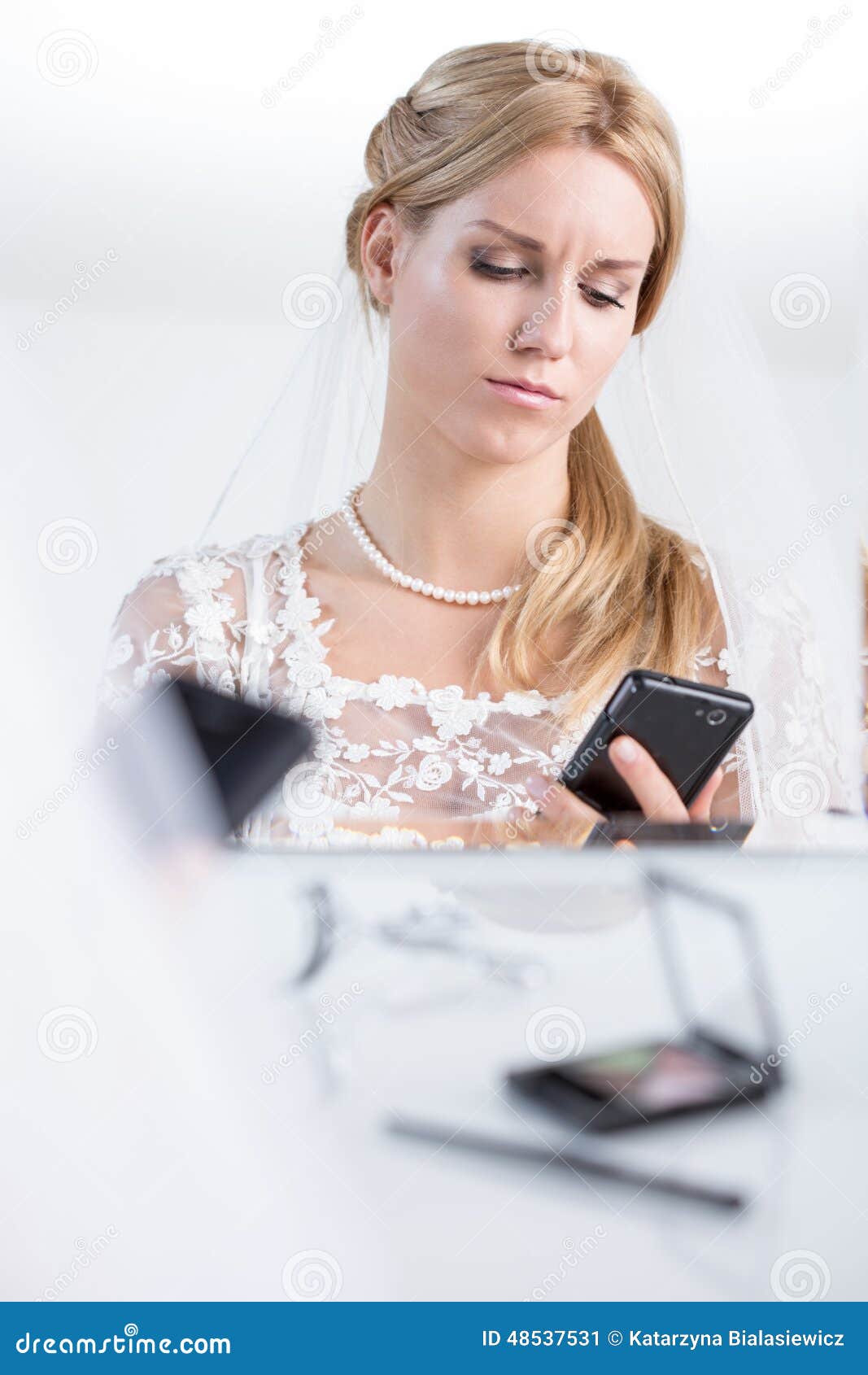 Worried Bride Holding Phone Stock Image - Image of makeup, looking ...