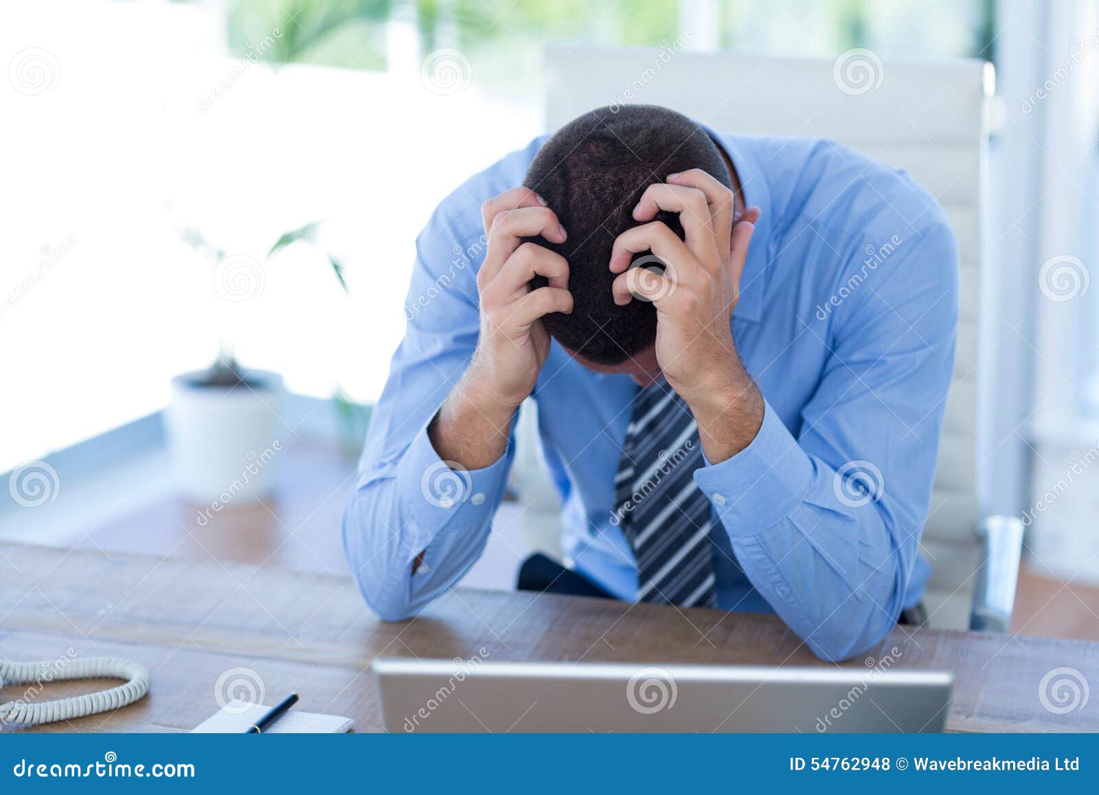 Worried Businessman with Head in Hands Stock Photo - Image of suit ...
