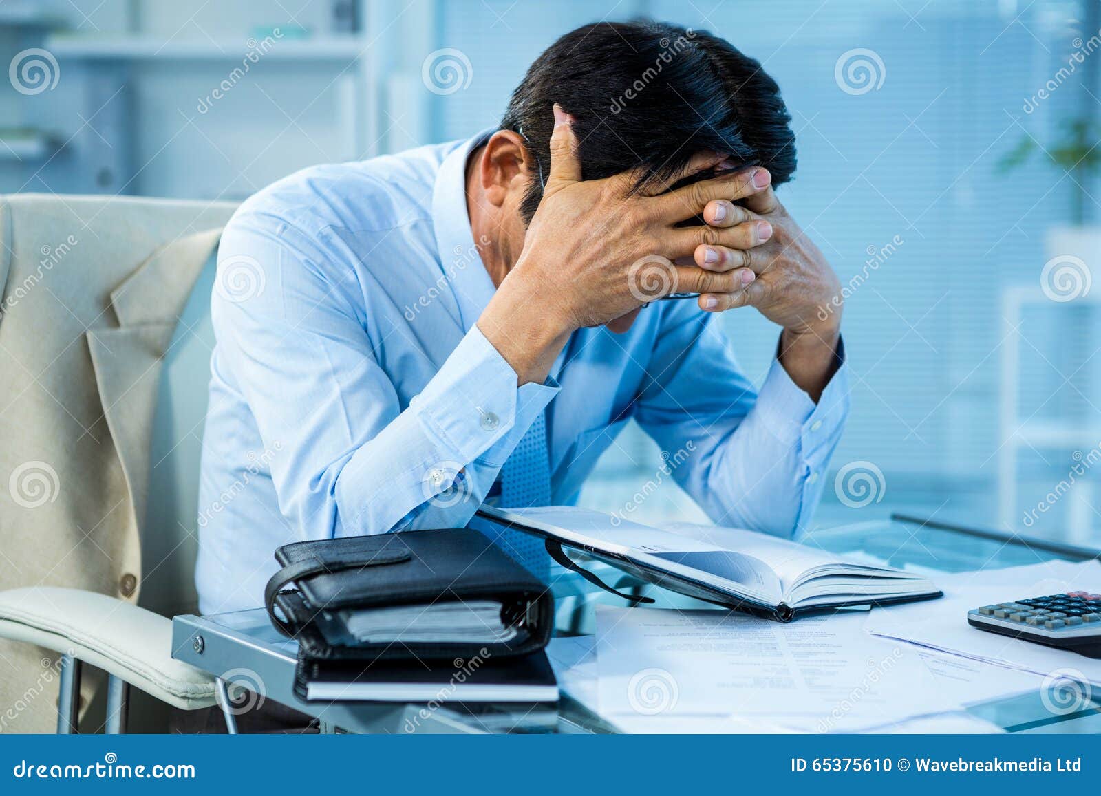 Worried Businessman Working at His Desk Stock Photo - Image of office ...