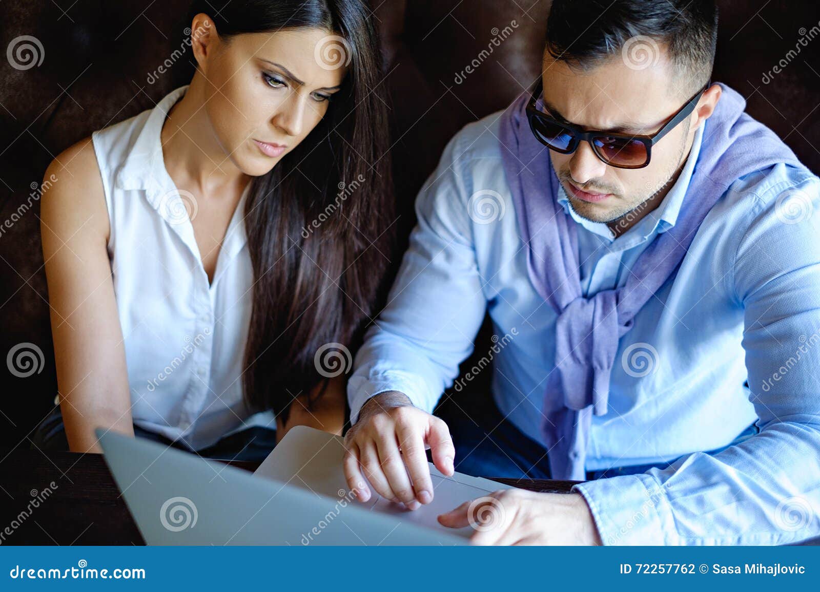 Worried Colleagues Looking at Notebook Stock Photo - Image of female ...