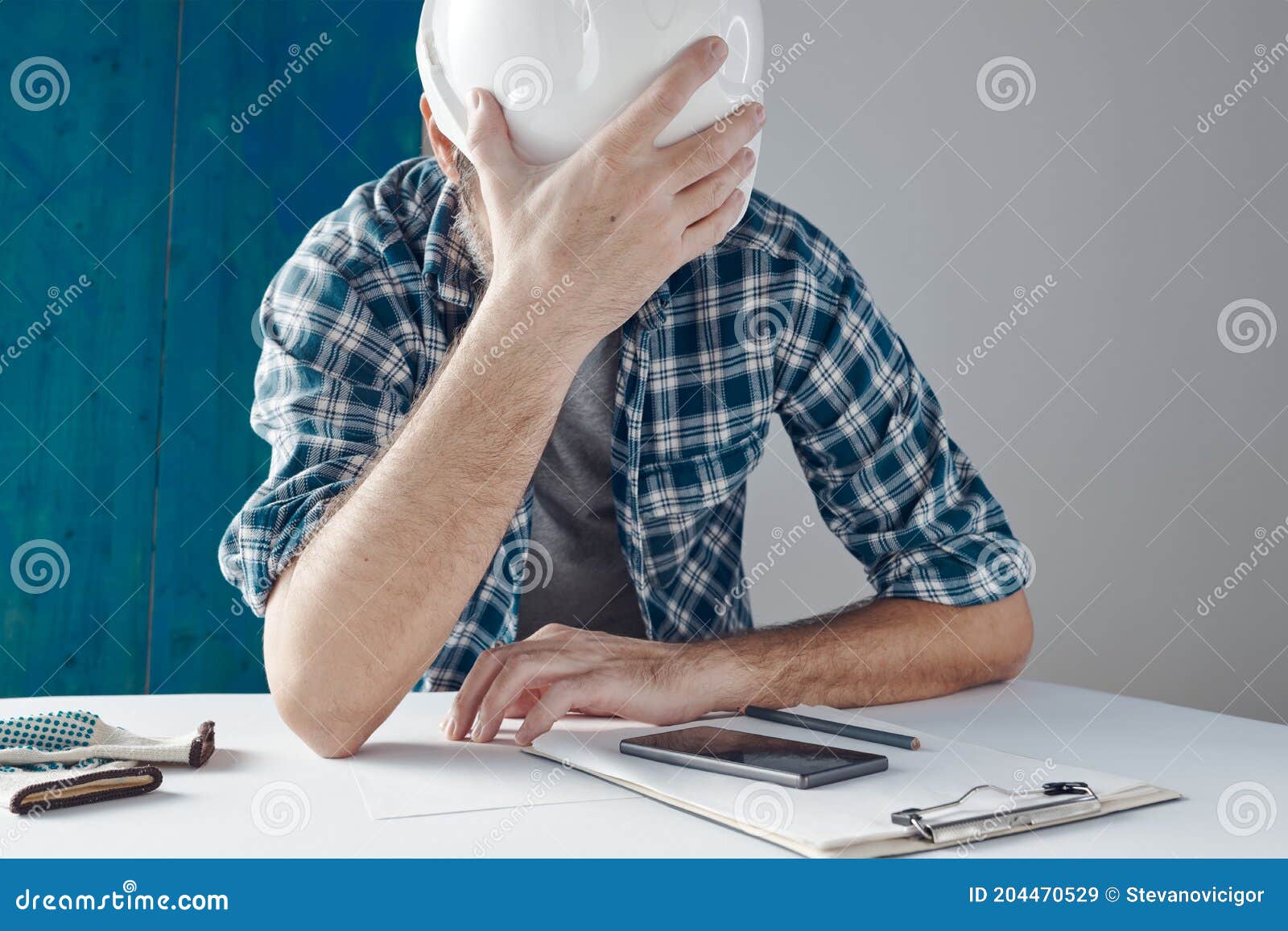 Worried Construction Engineer Project Manager after Reviewing Notes ...