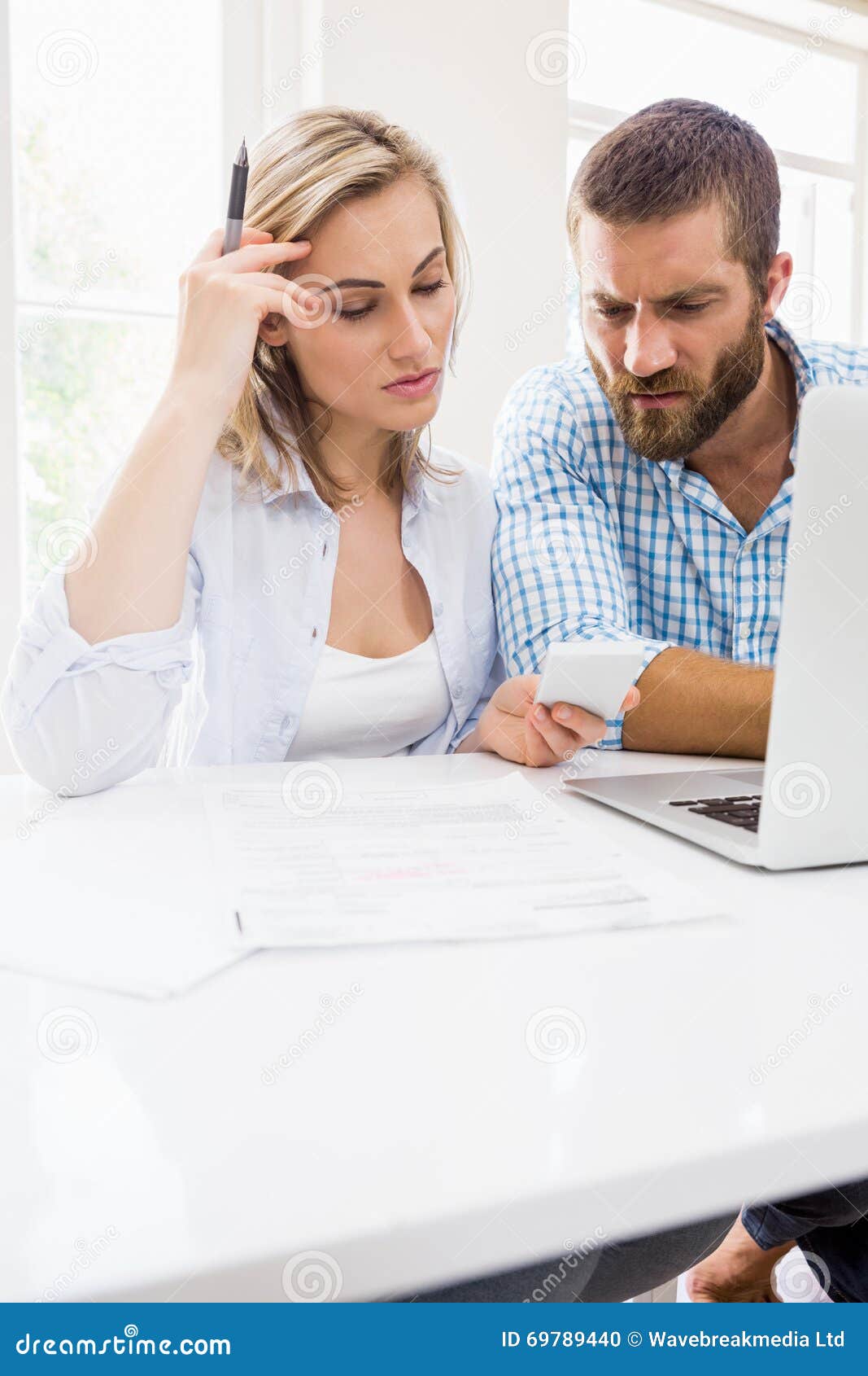 Worried Couple Looking at Mobile Phone Stock Photo - Image of depressed ...