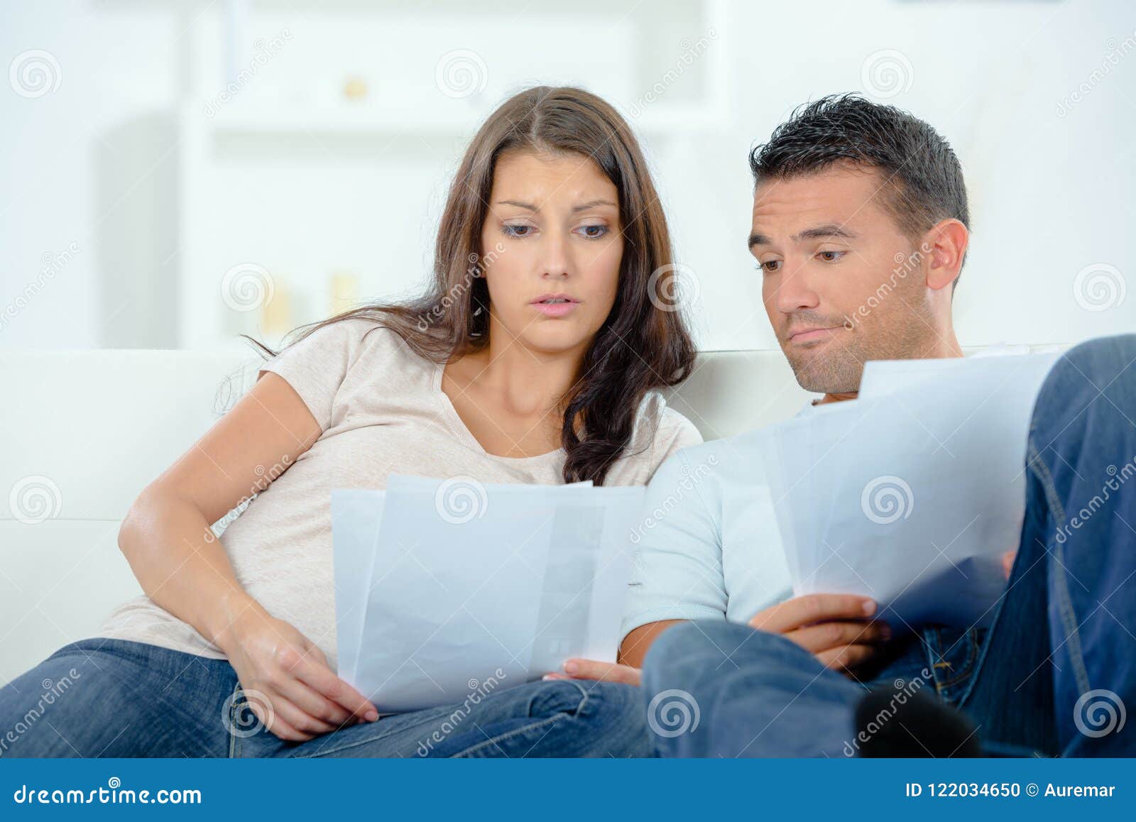 Worried Couple Looking at Paperwork Stock Photo - Image of arrears ...
